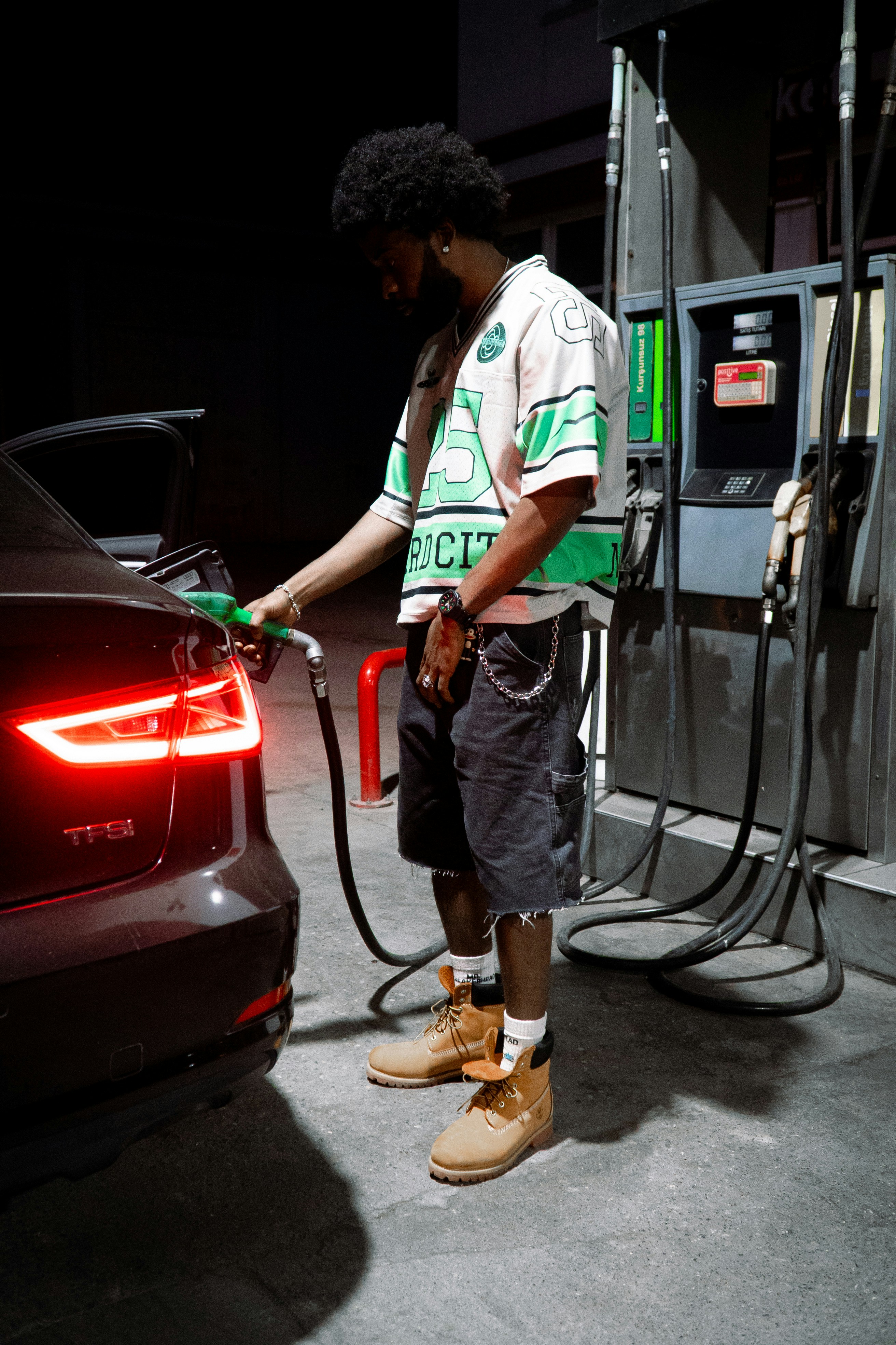 Midnight refill: A solitary refuel at the neon-lit pump