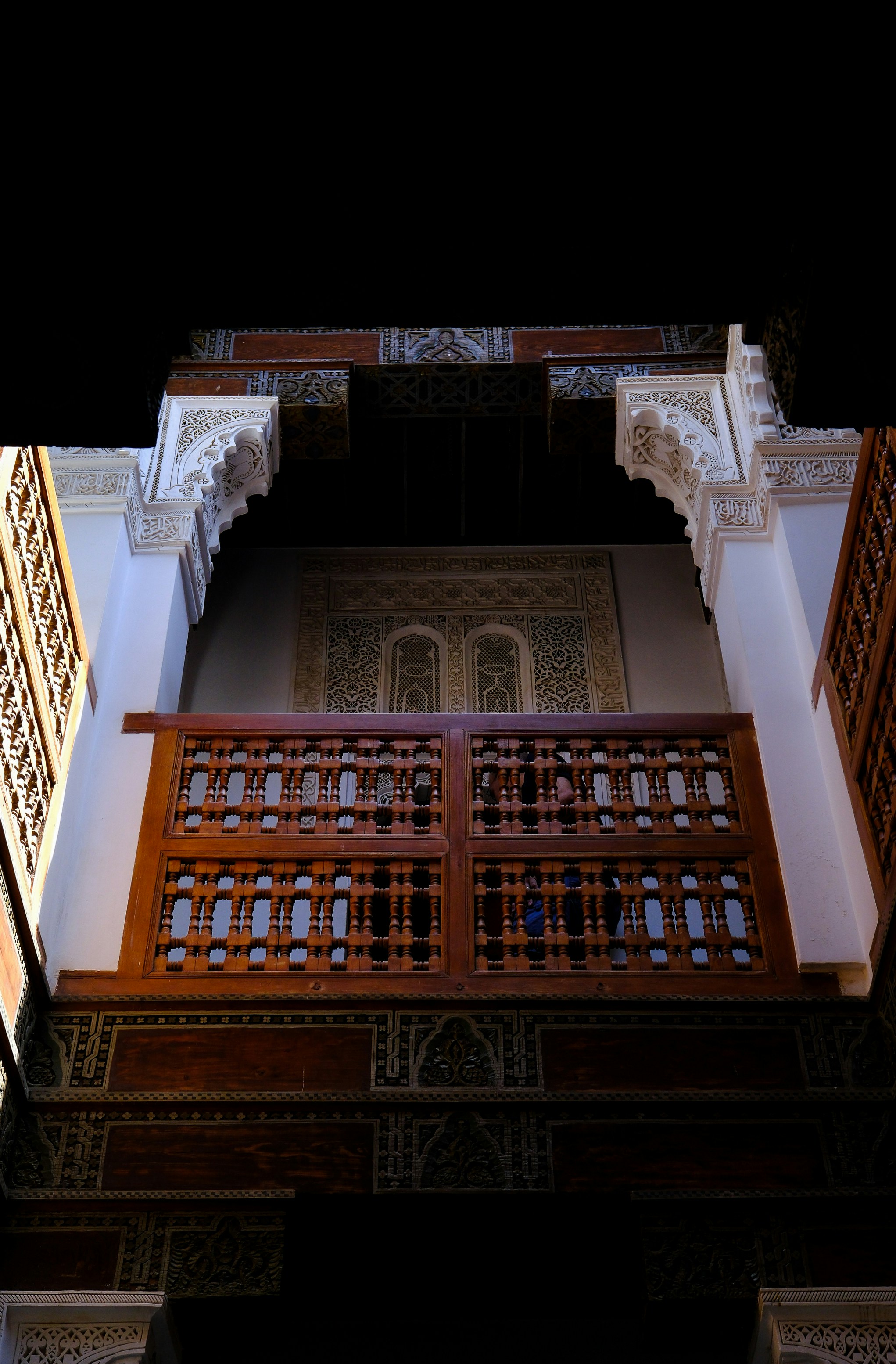 Ornate wooden balcony with intricate geometric patterns