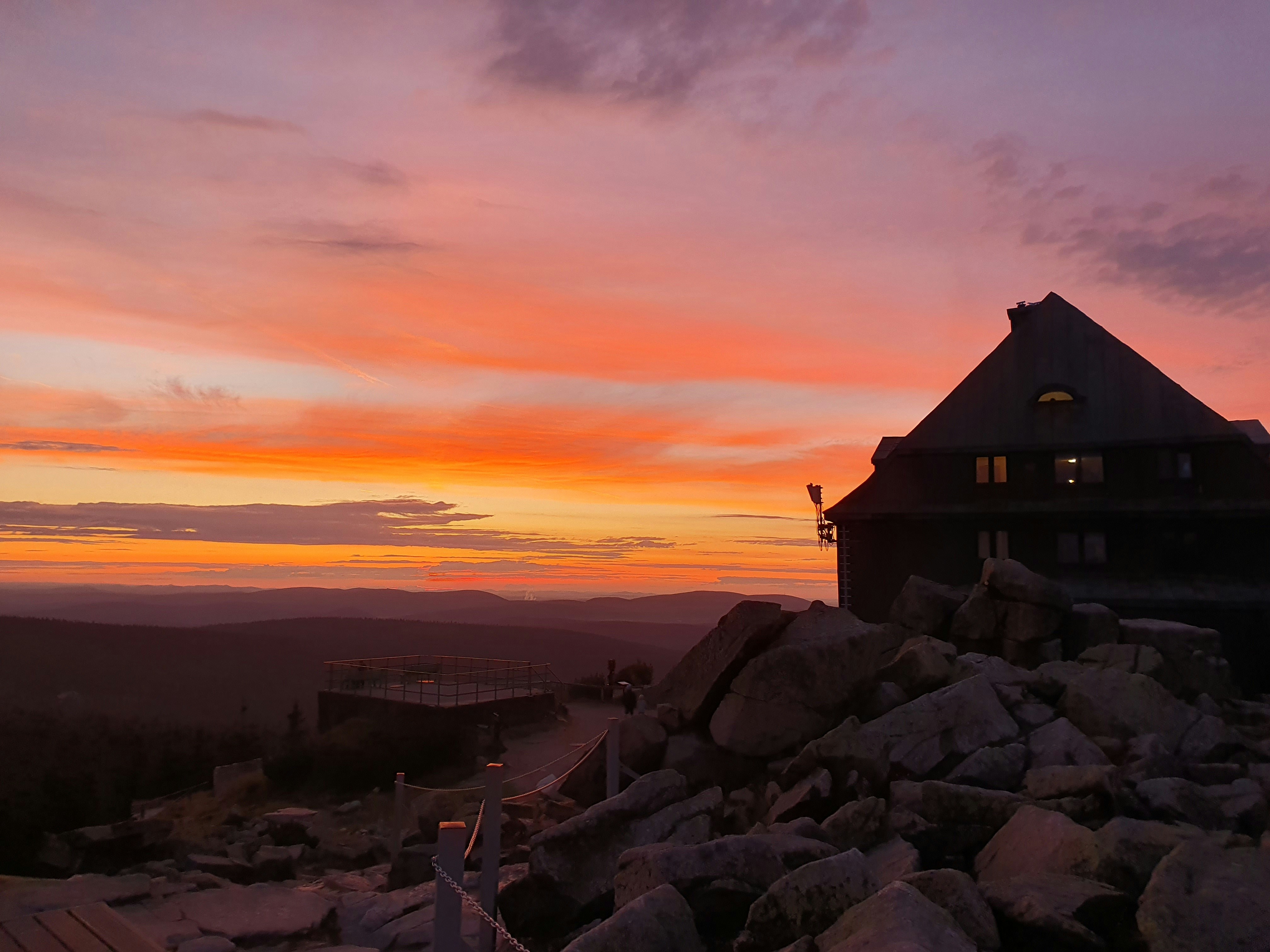 Sunset Ridge Retreat: A Silhouette Against Fiery Horizon