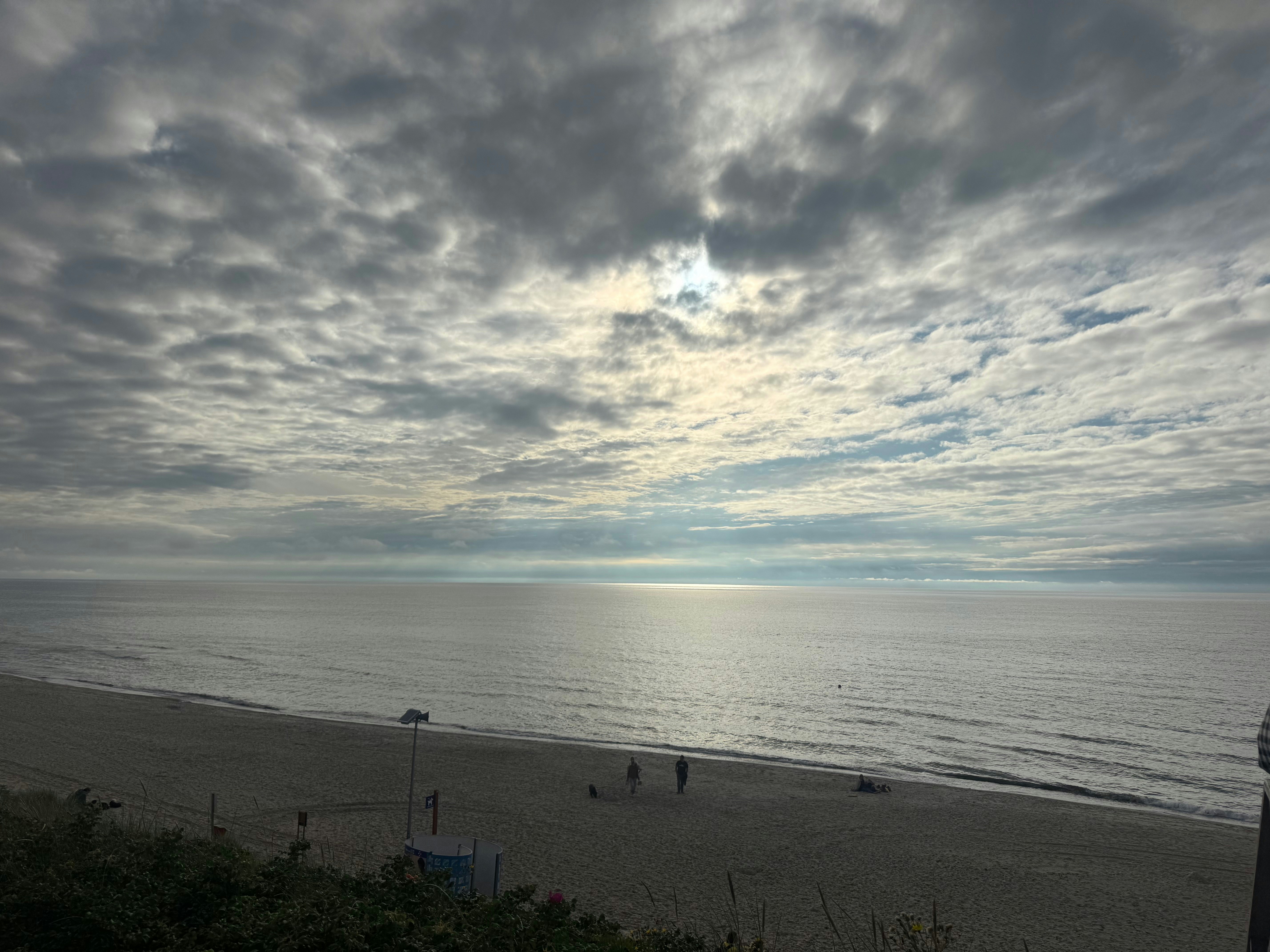 Sea | Beach scene with cloudy sky and calm ocean