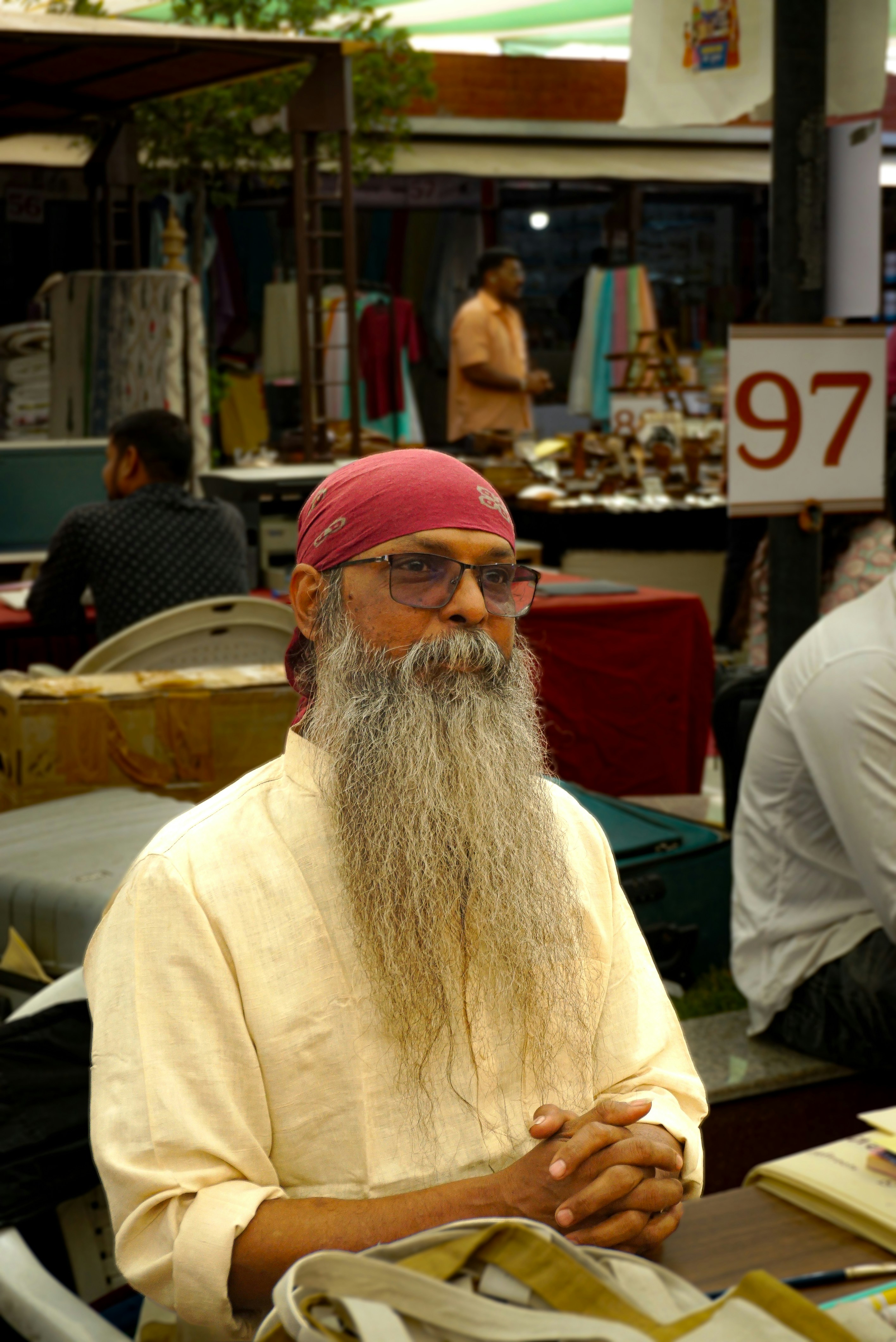 Man with long beard and bandana at market
