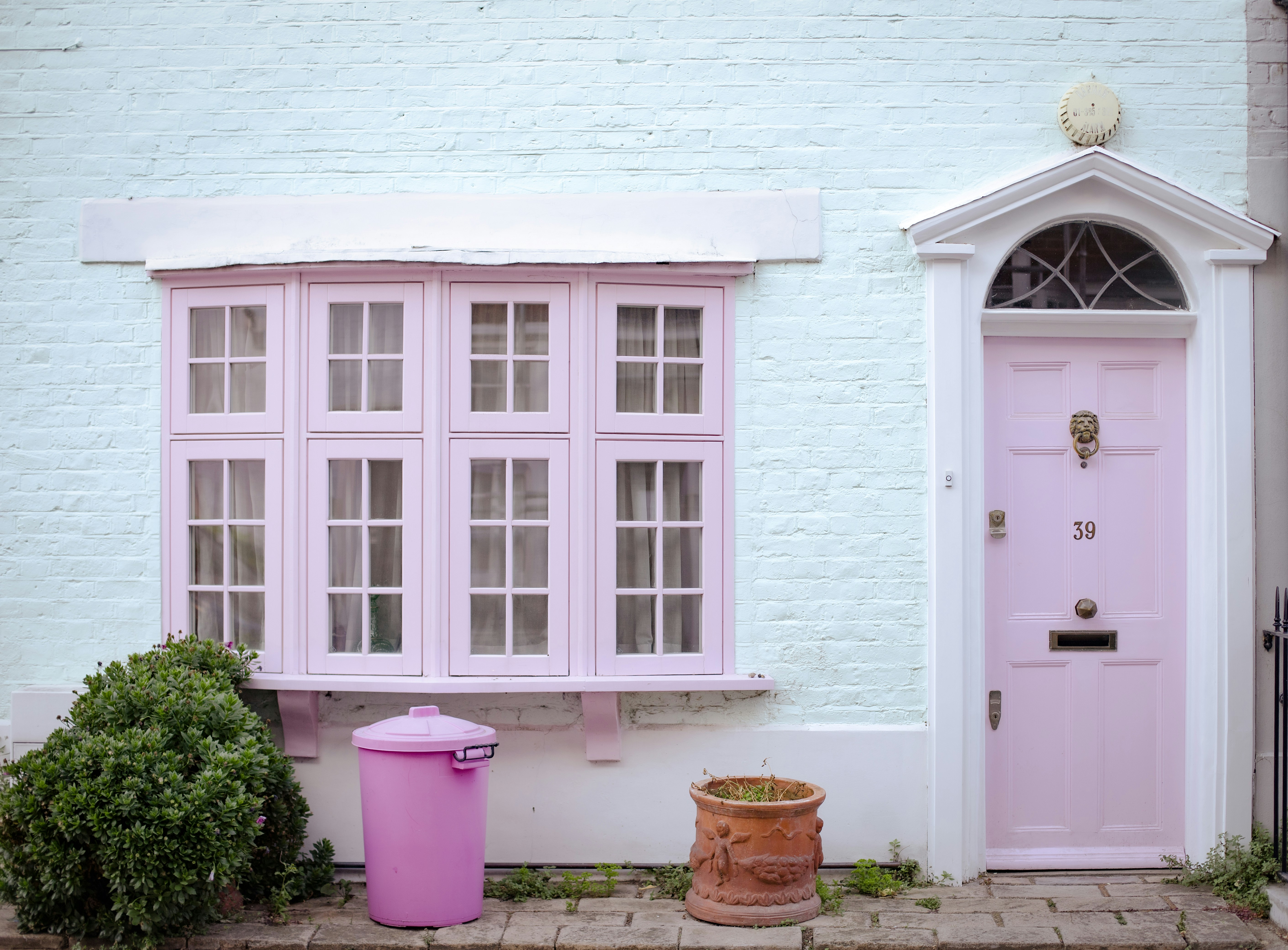 Candy-Pink Doorway on a Mint-Faced Cottage