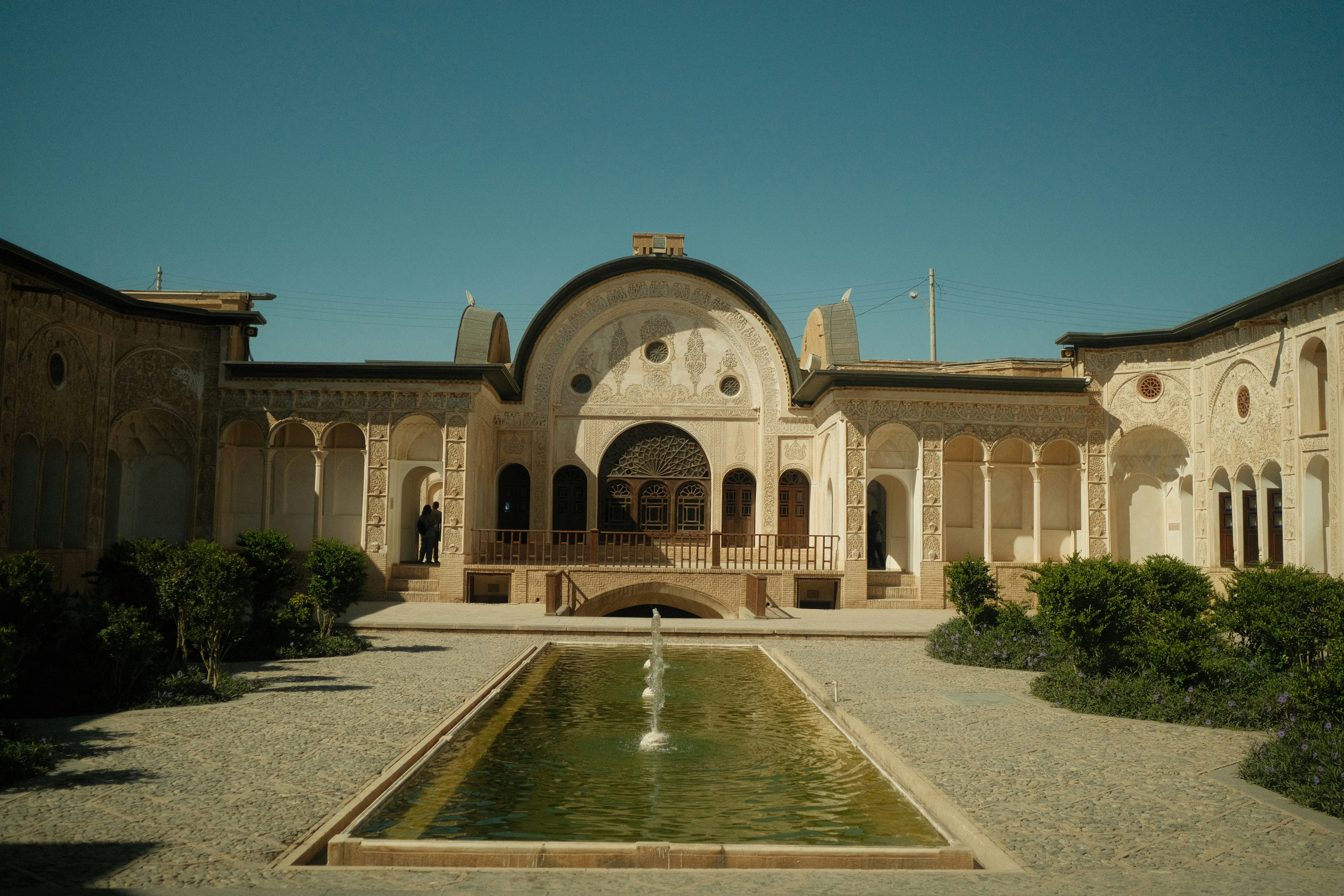 Courtyard of a historic building with a fountain.