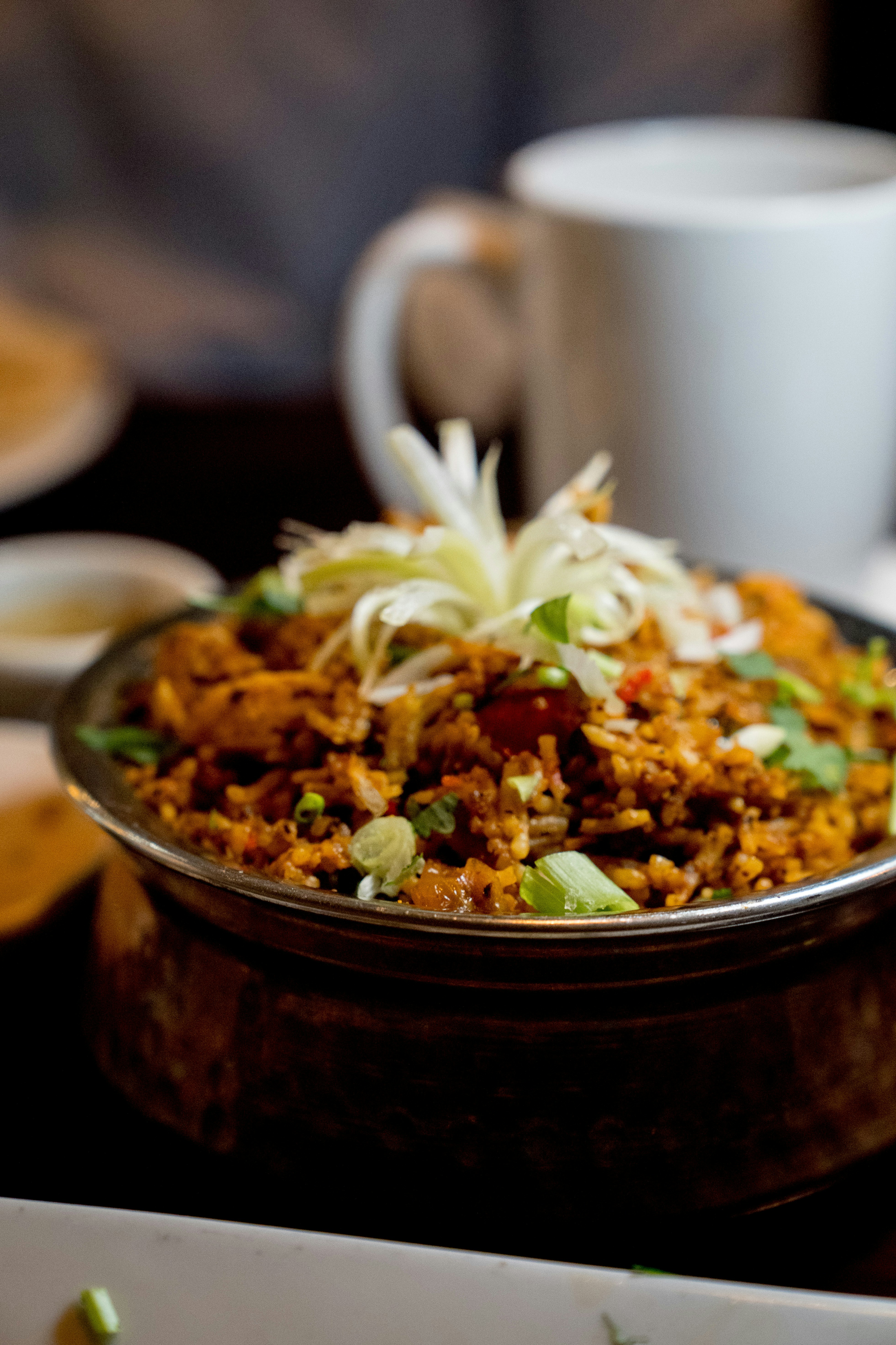 Bowl of flavorful fried rice with green onions