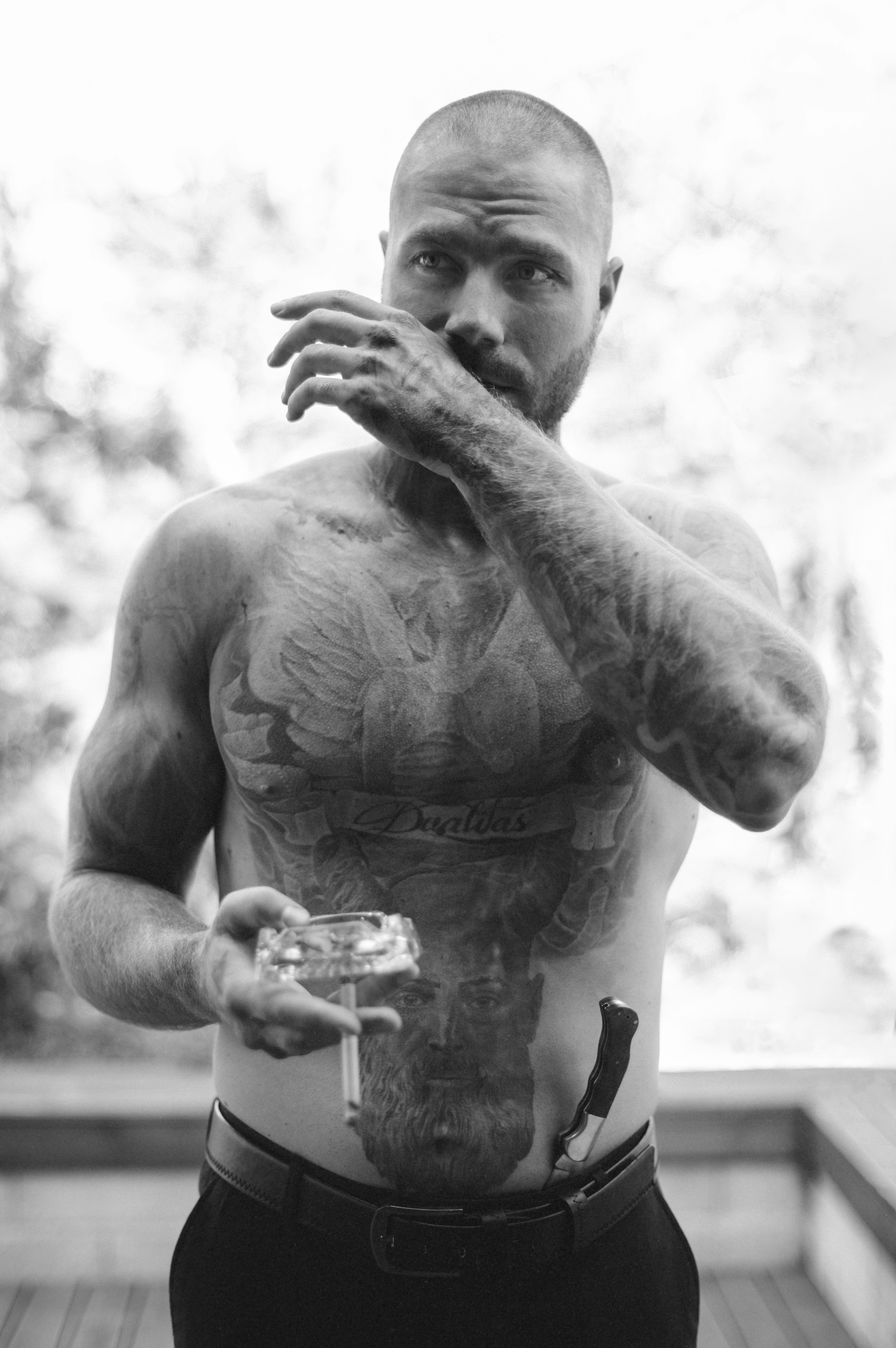 Ink and Gaze: A Tattooed Portrait in Soft Monochrome Light