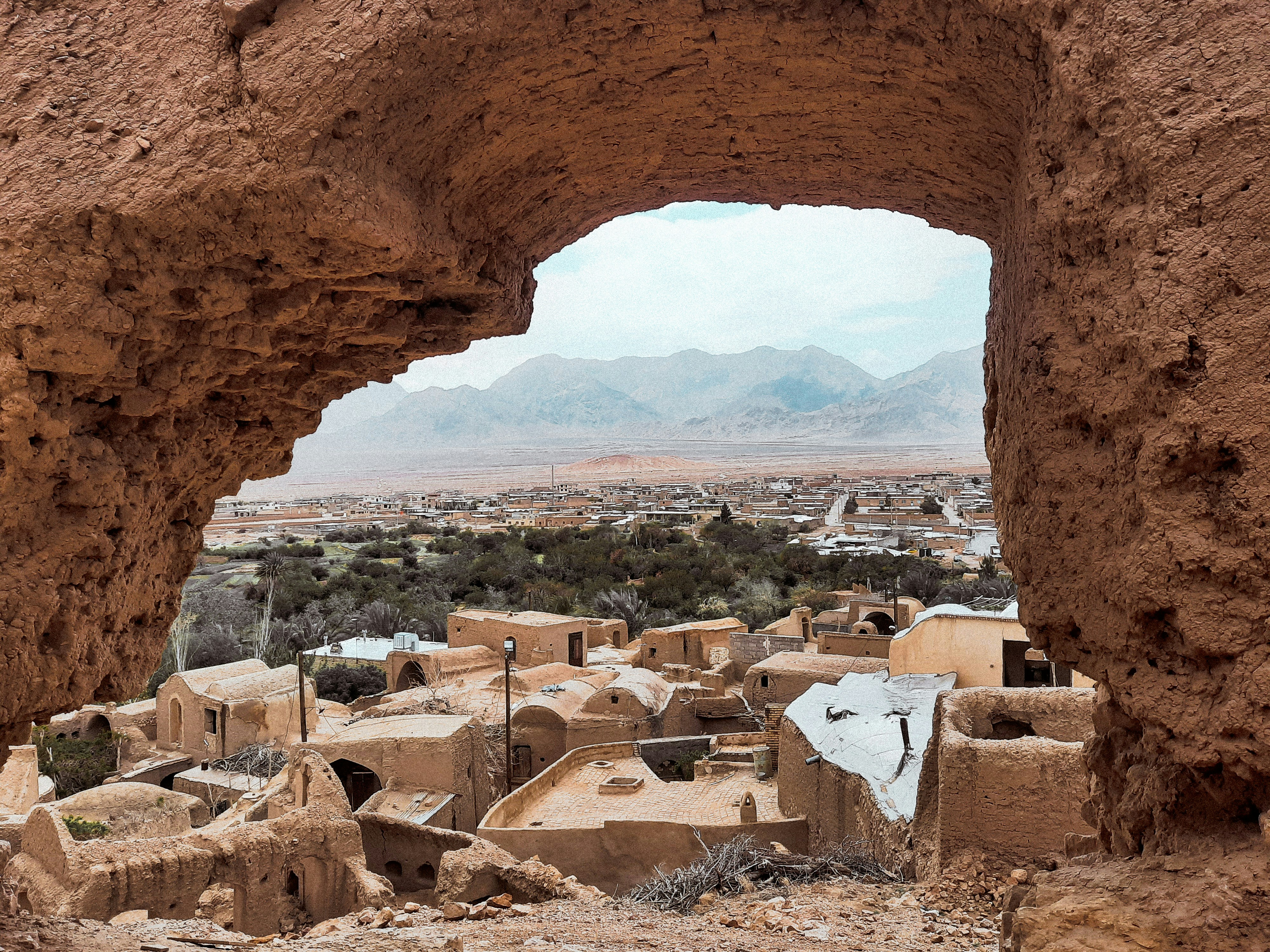 Ancient village ruins with mountains in the background