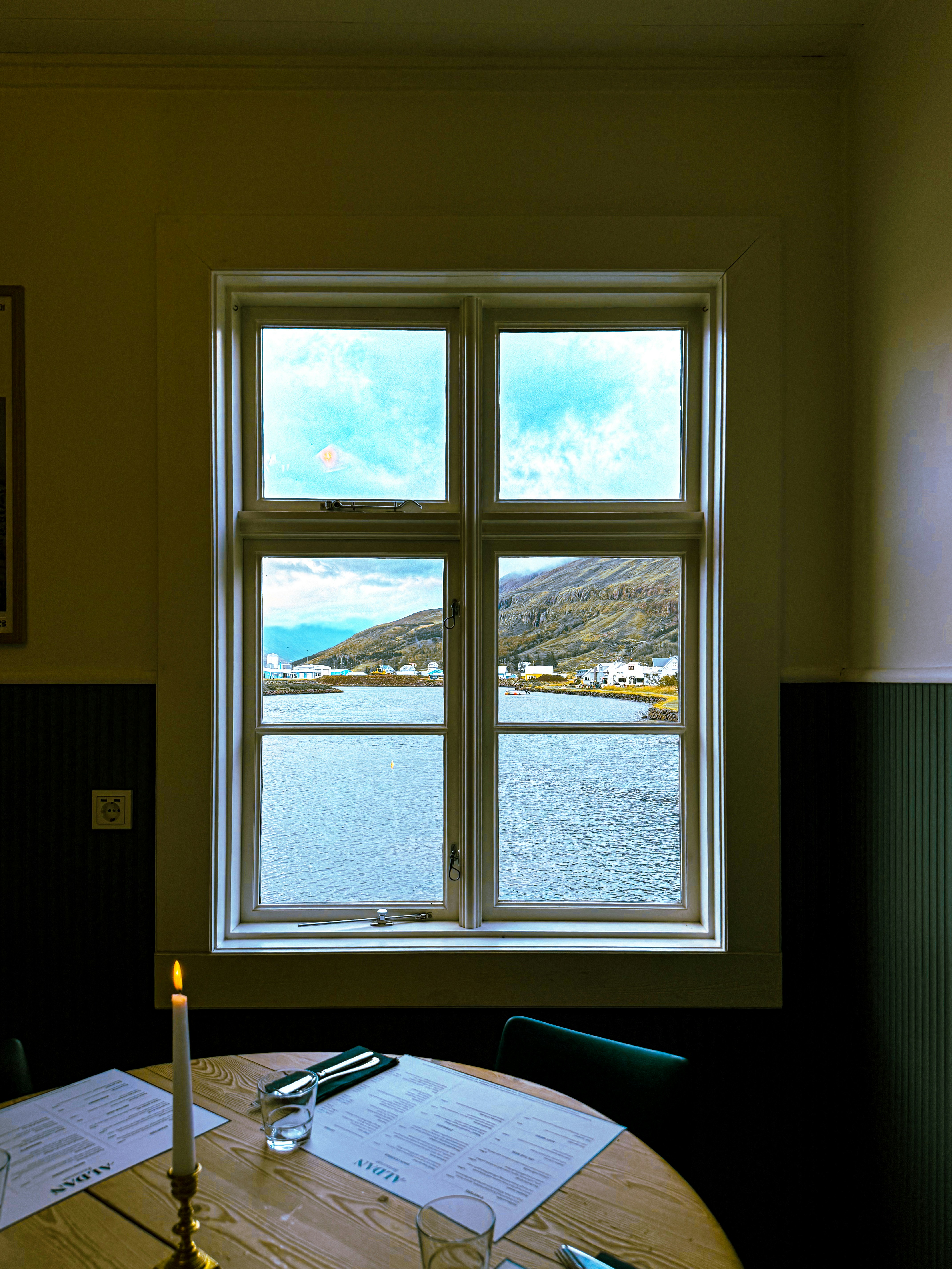 Serene Harbor View Through a Rustic Window