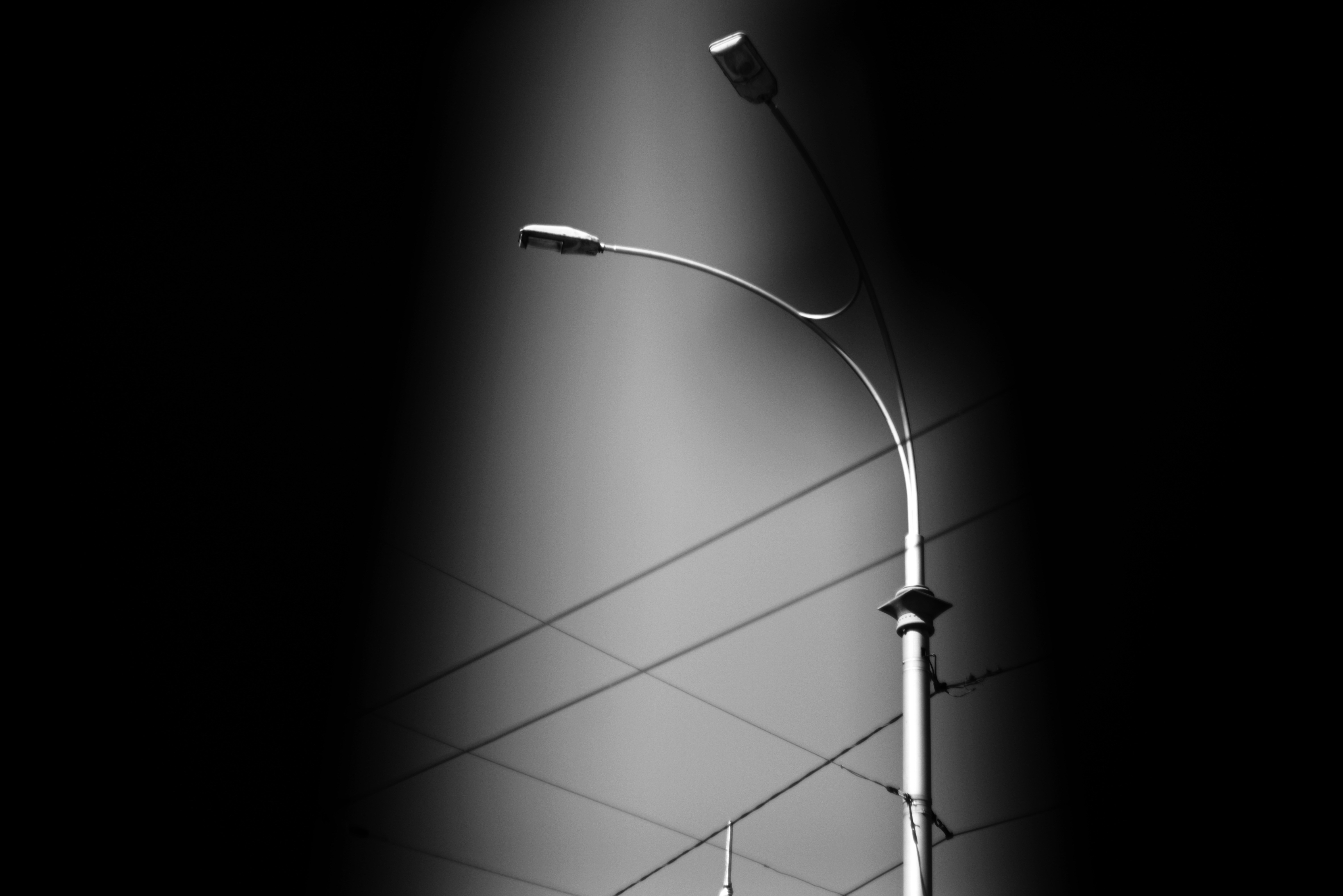 Streetlights against a dark, textured background.