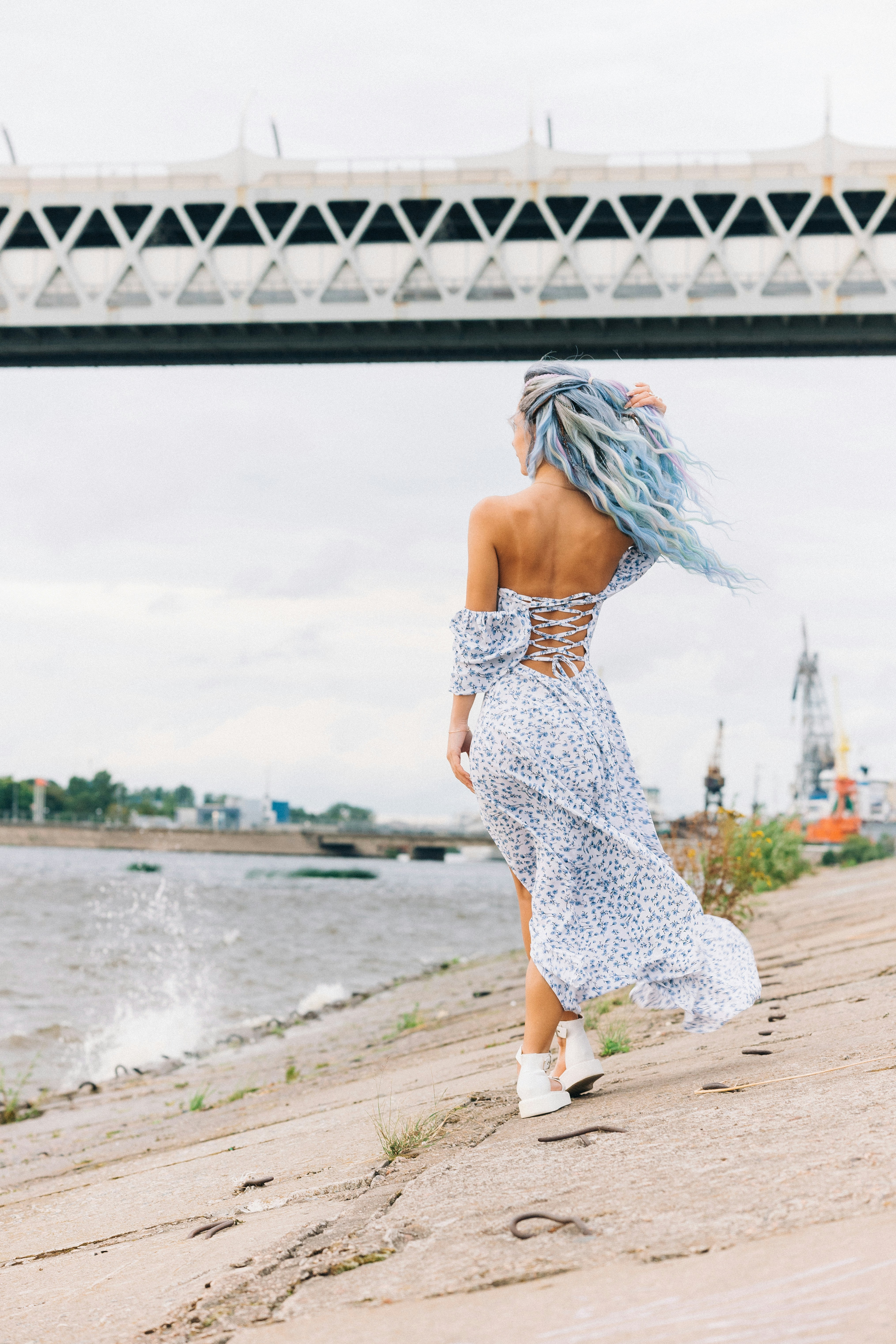 Wind-Swept Pose by the River: Blue-Haired Glow by the Bridge