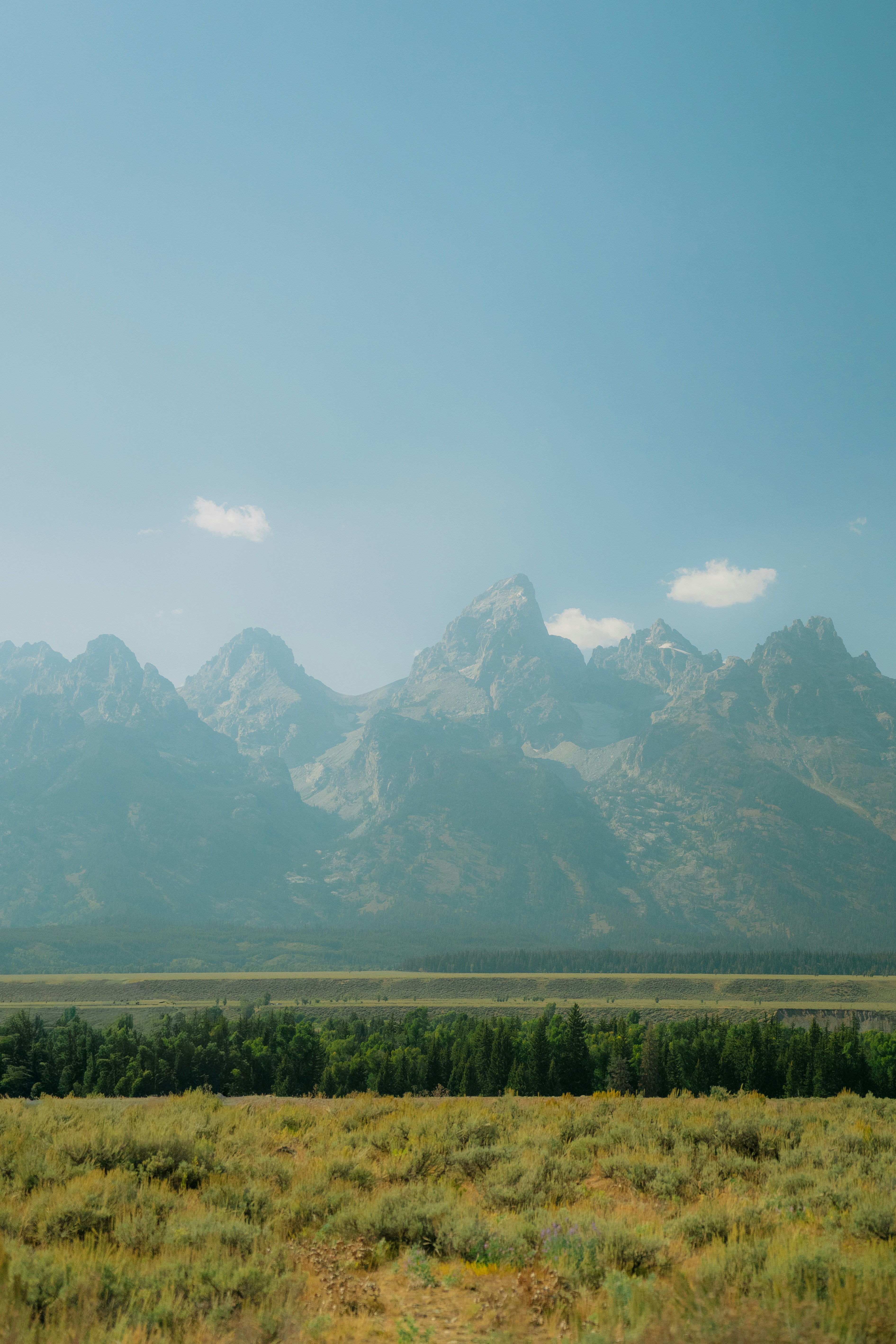 Moonlit Peaks Over Prairie Plains