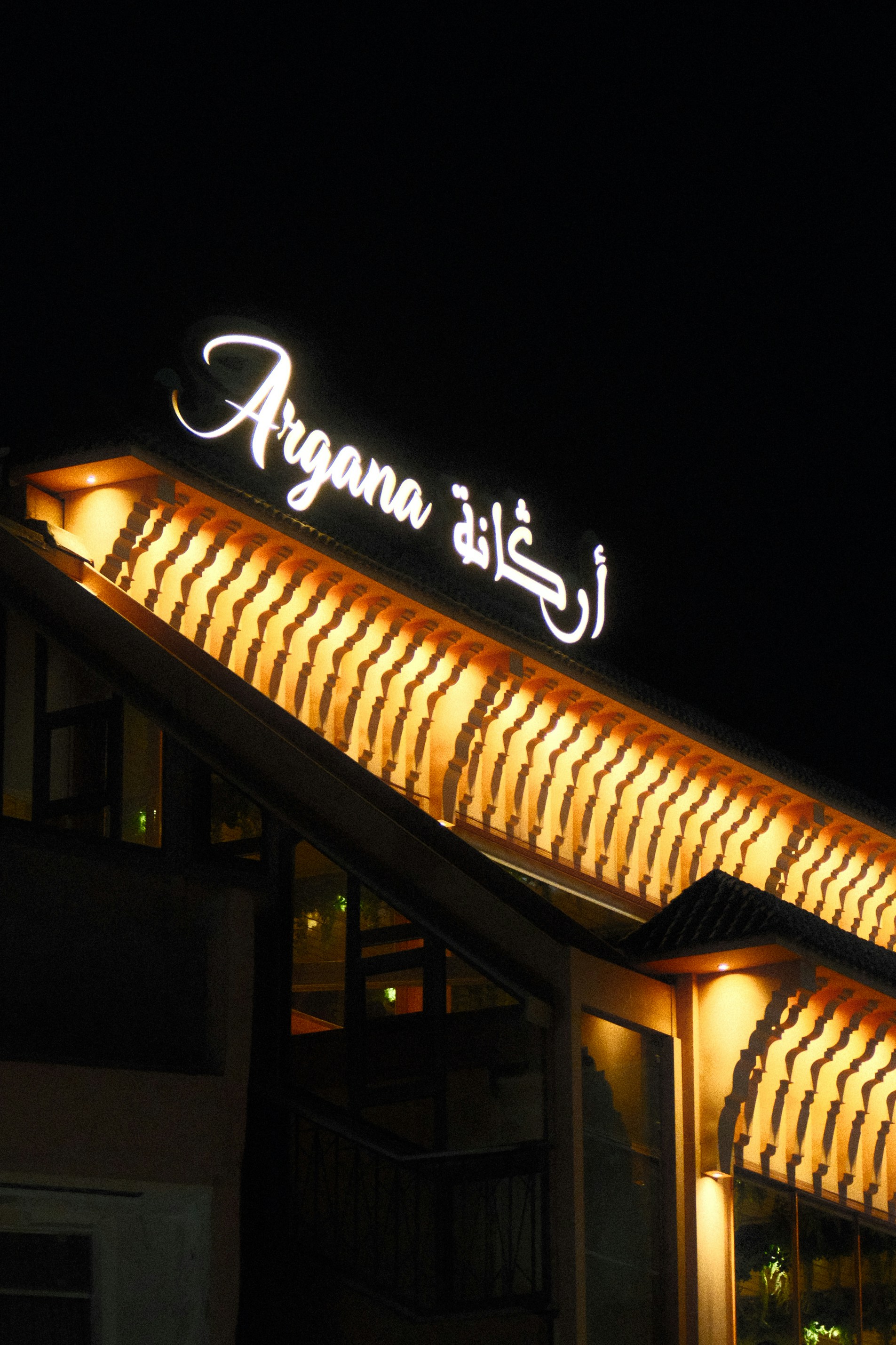 Argana restaurant sign illuminated at night