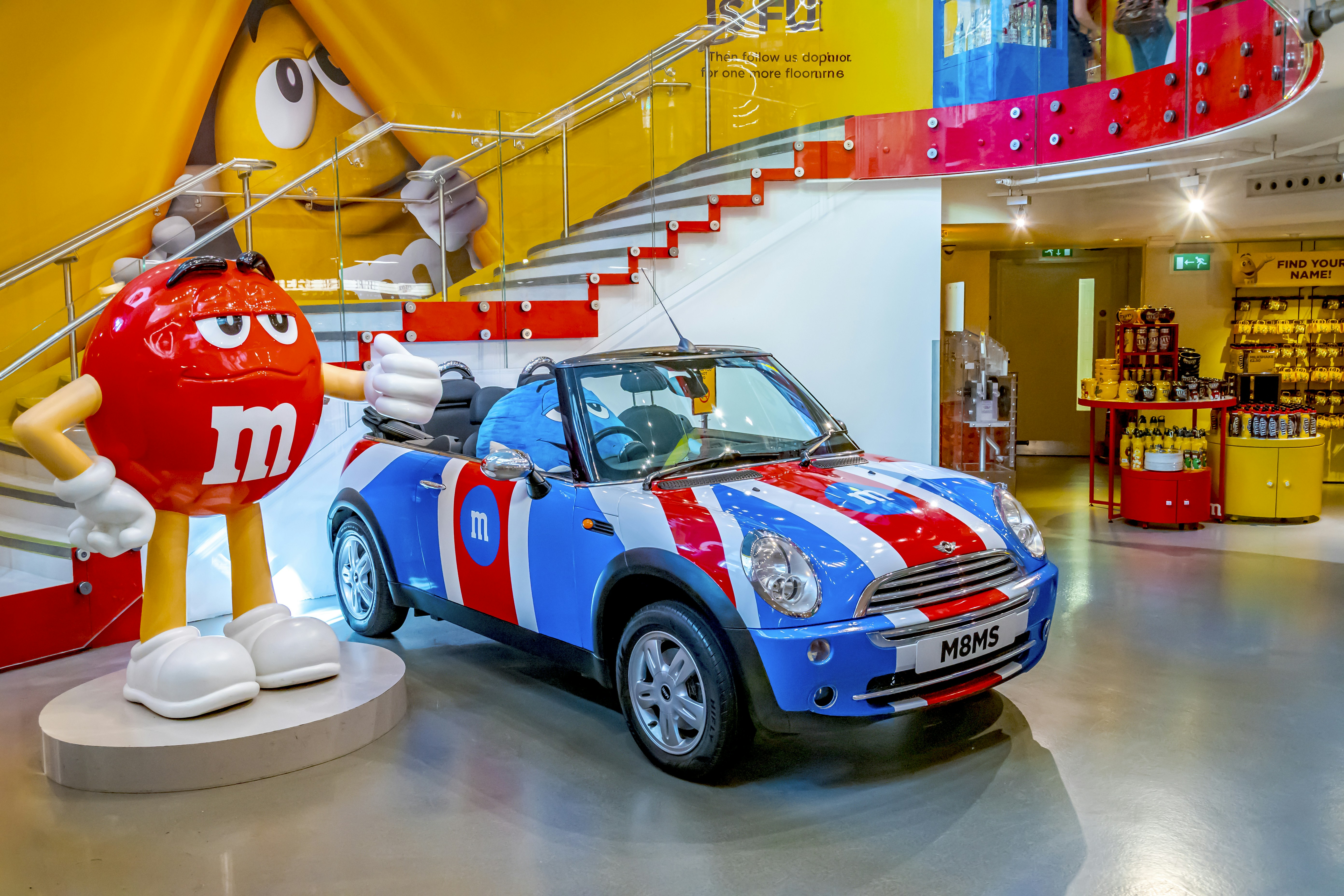 M&m's characters with a union jack mini cooper car.