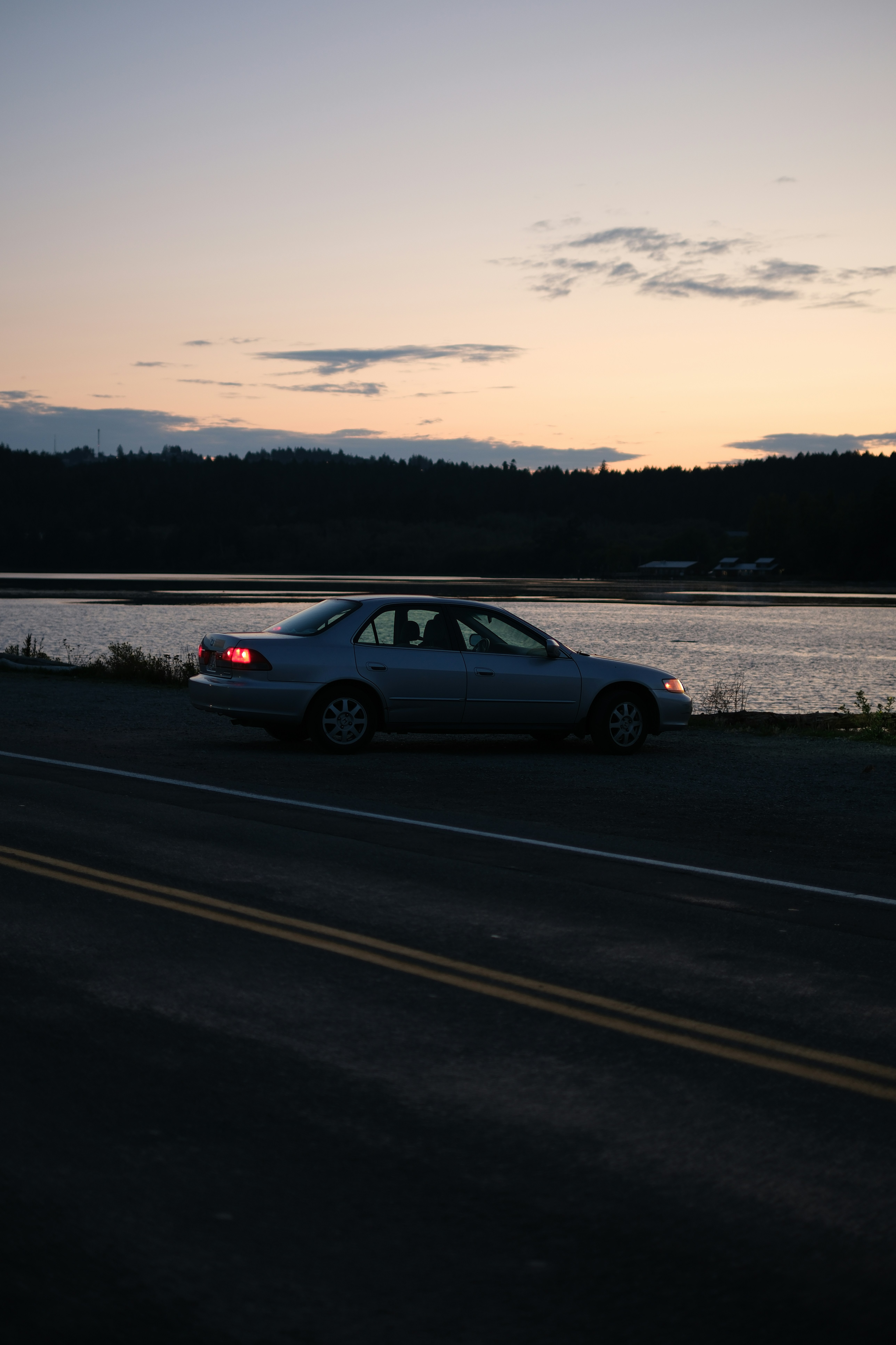Twilight Reflections: A Serene Drive by the Water