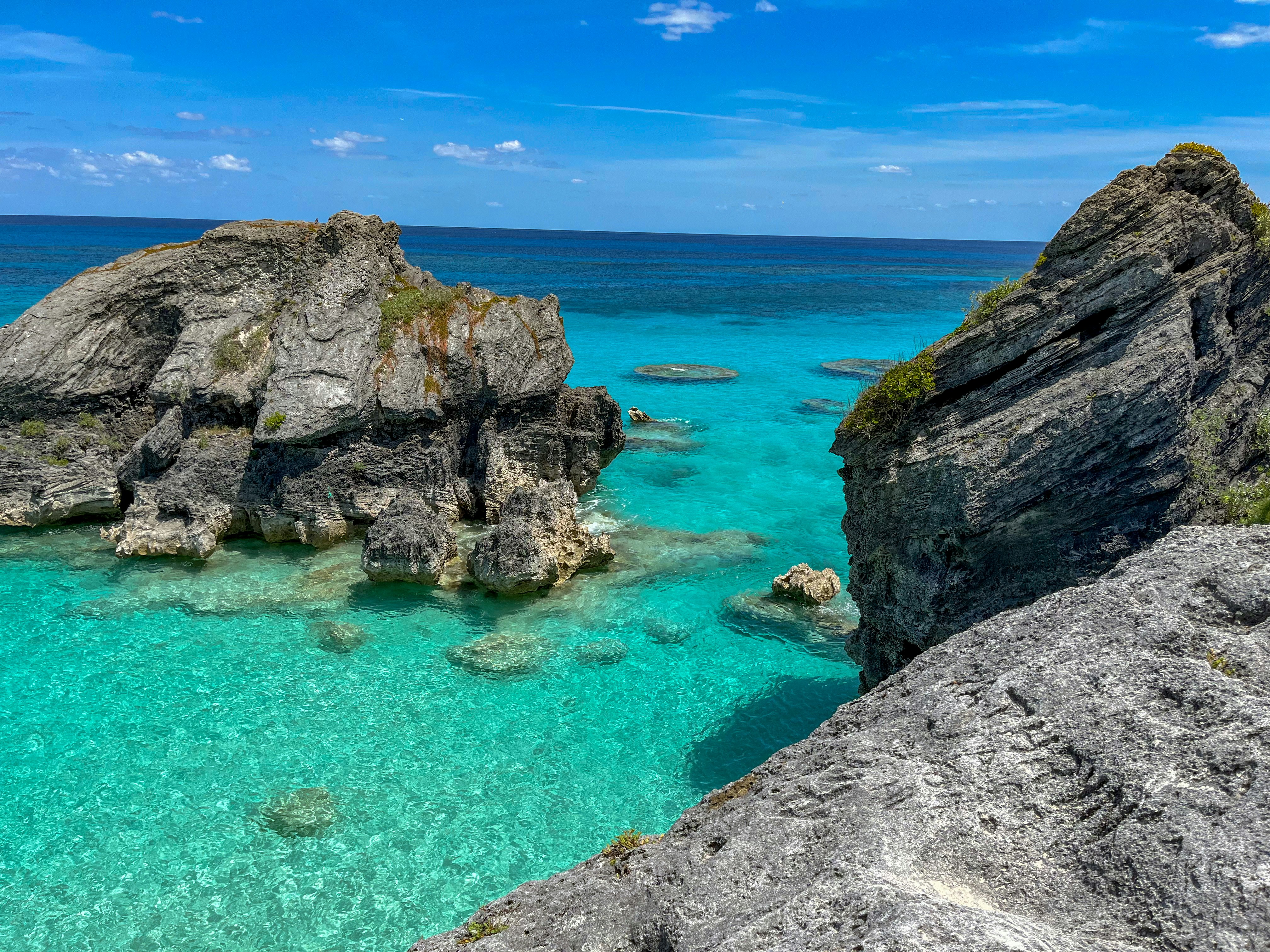 Rocky coastline with turquoise water and clear blue sky