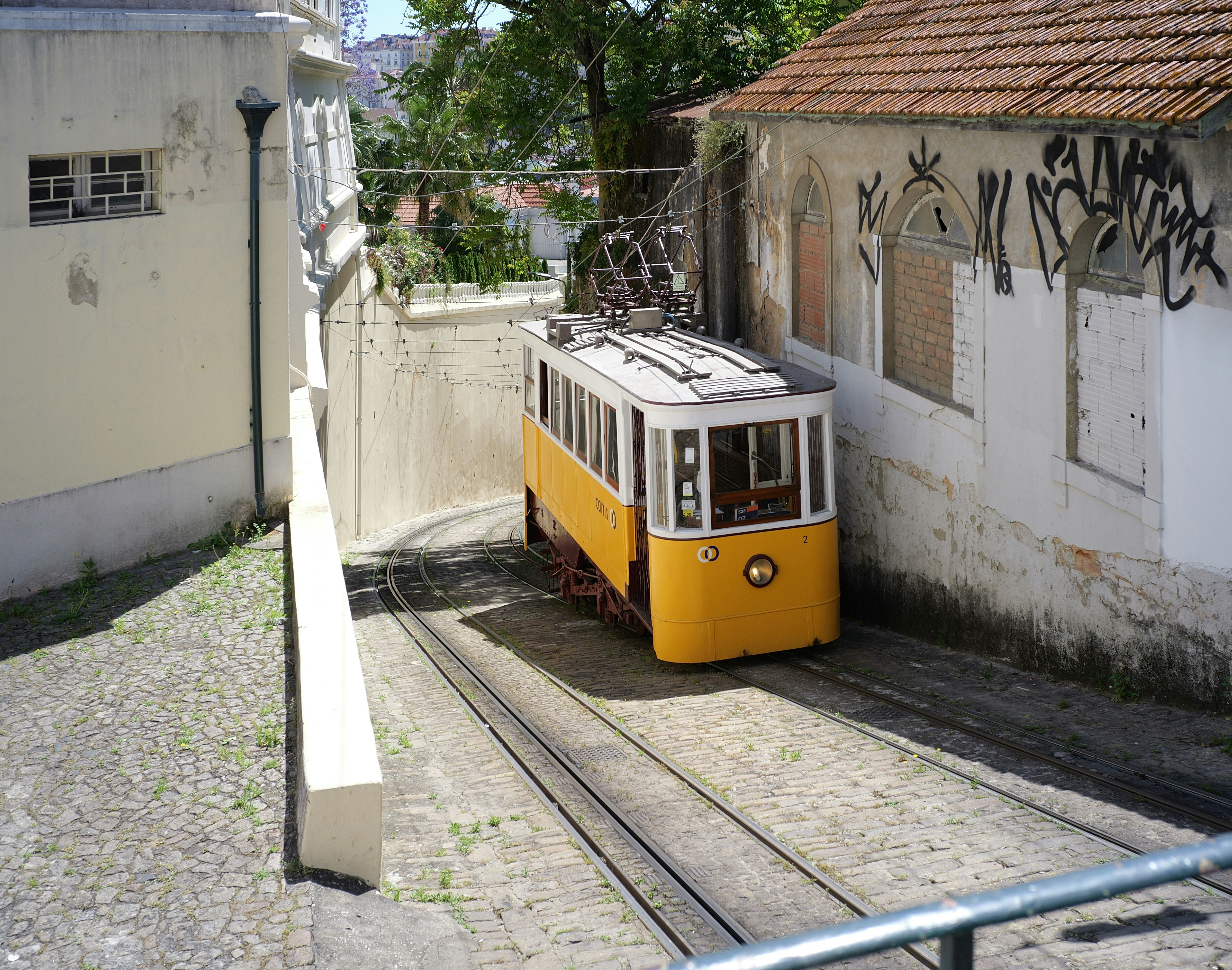 Urban Journey: The Yellow Tram's Ascent