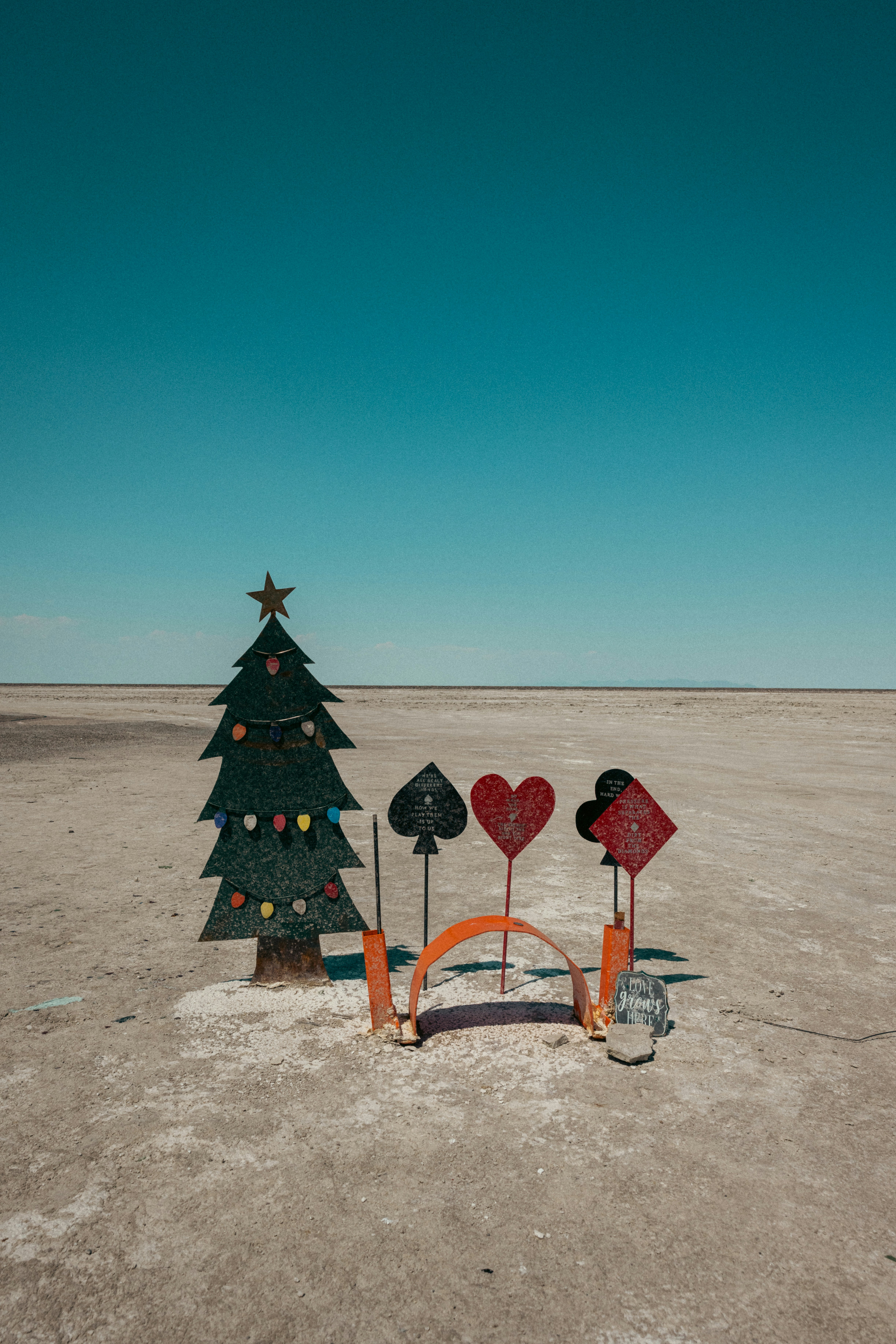 Christmas tree and playing card decorations in desert