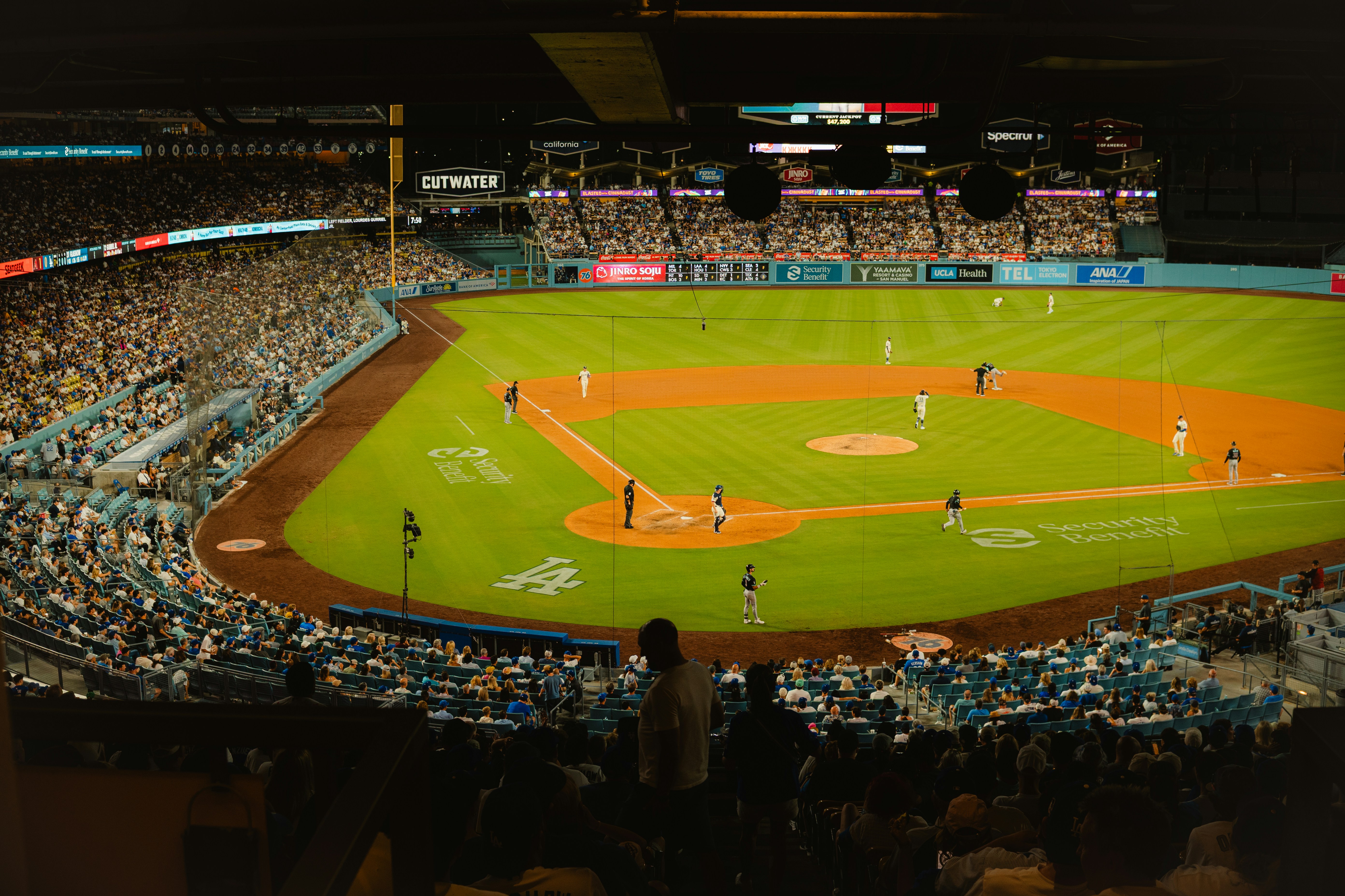 Baseball stadium filled with spectators during a game.
