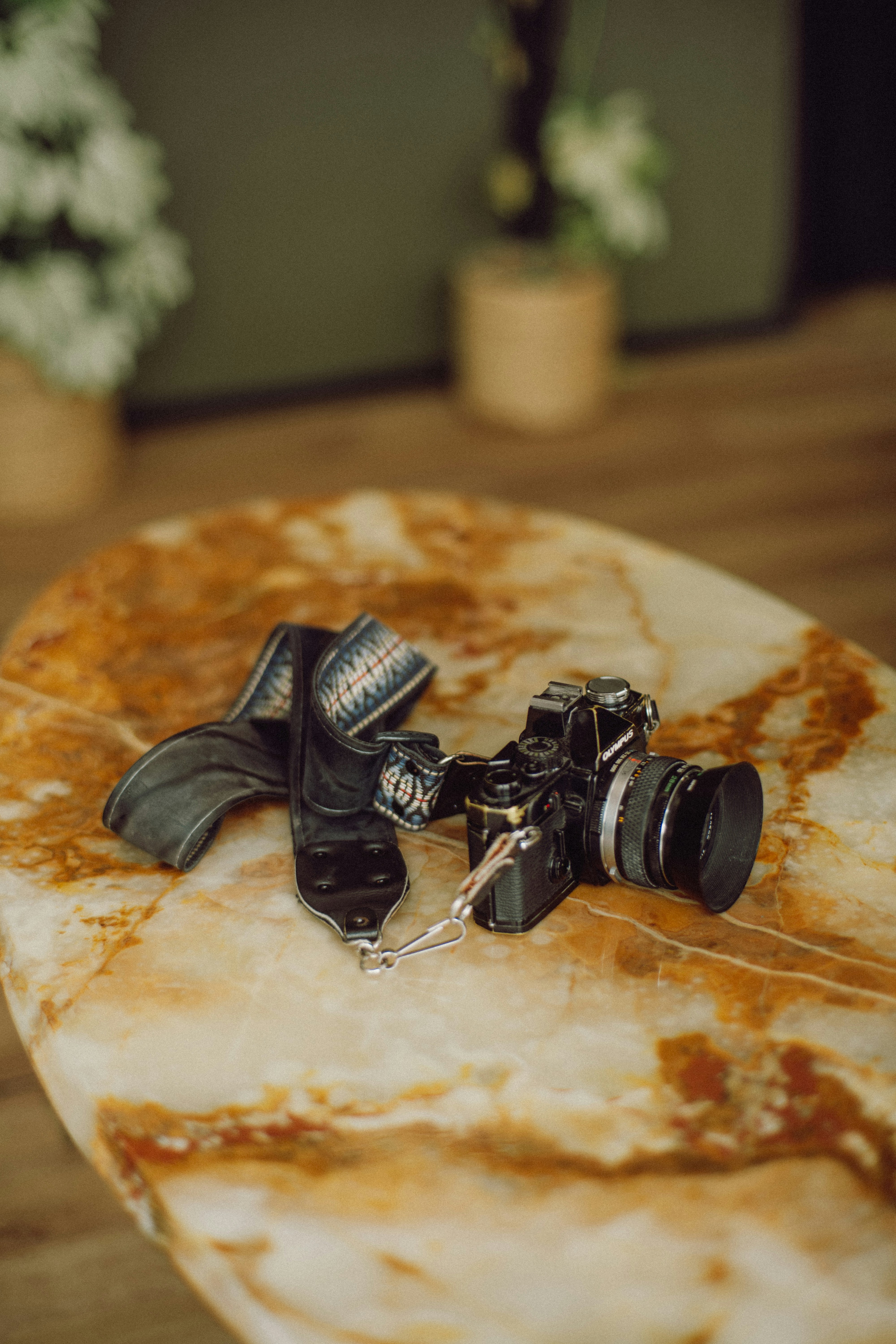 Vintage camera with strap on marble table photo – Free Camera Image on ...