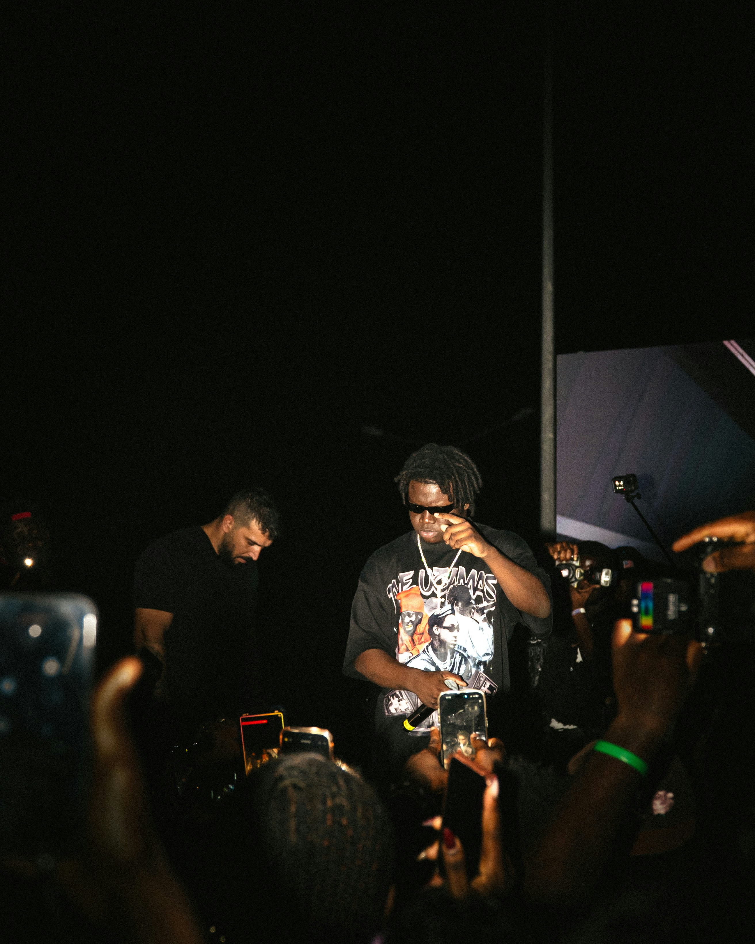 Musicians performing on stage for a crowd