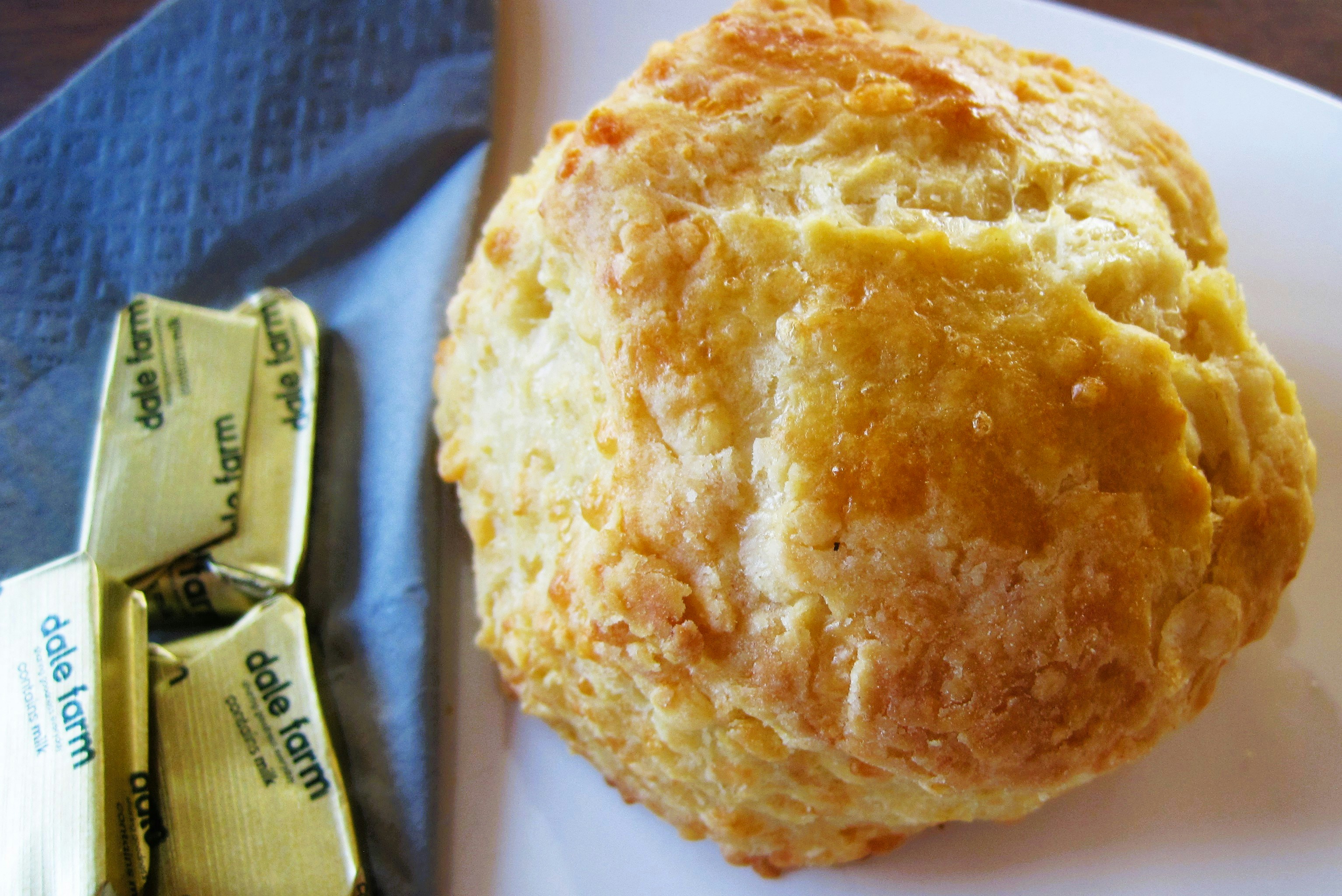 taken august 29th 2025 | Golden brown biscuit with two butter packets