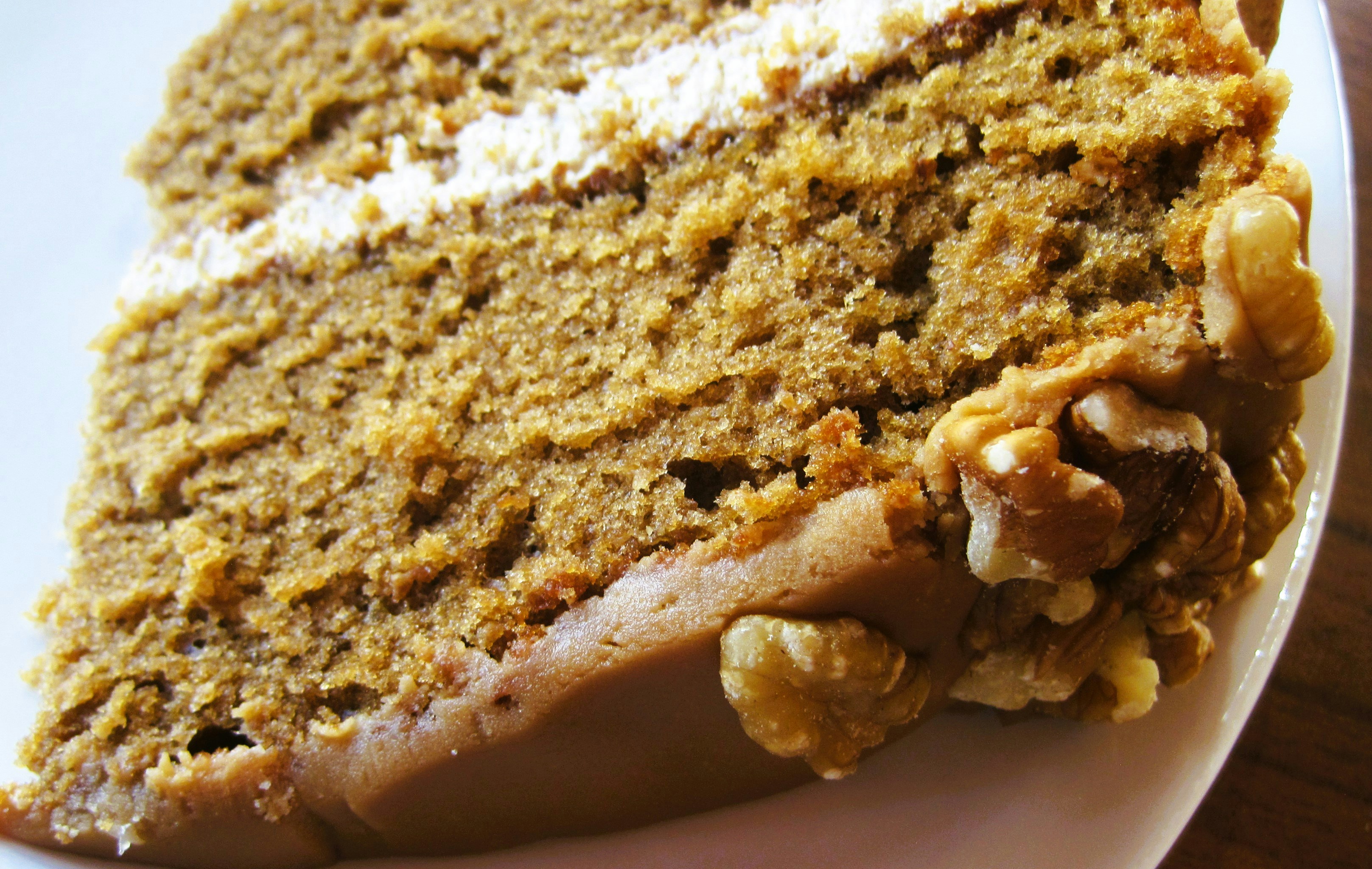 coffee cake taken august 29th 2025 | Slice of spiced cake with walnuts and frosting