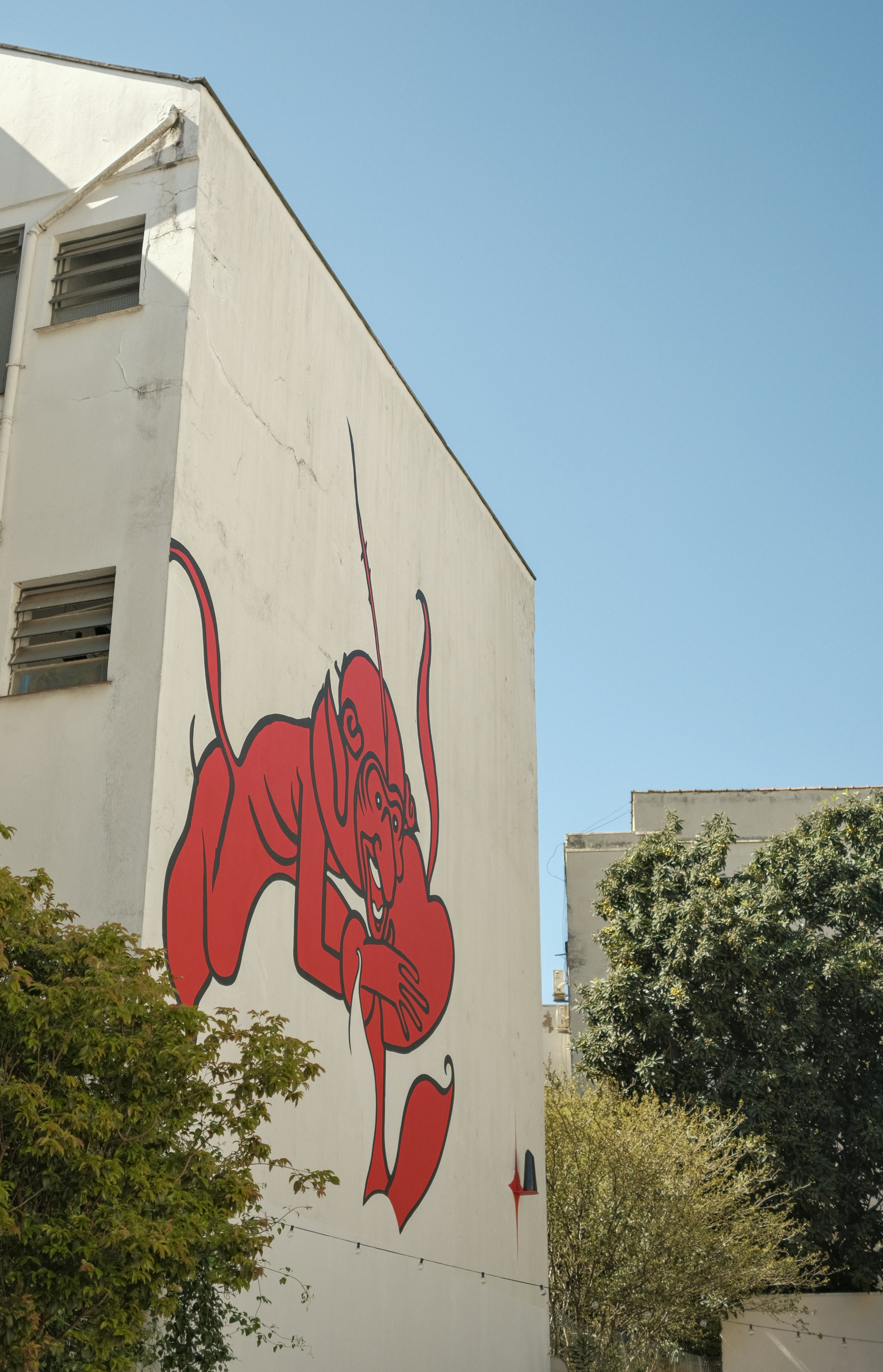 Whimsical Urban Guardian: A Playful Mural in the City