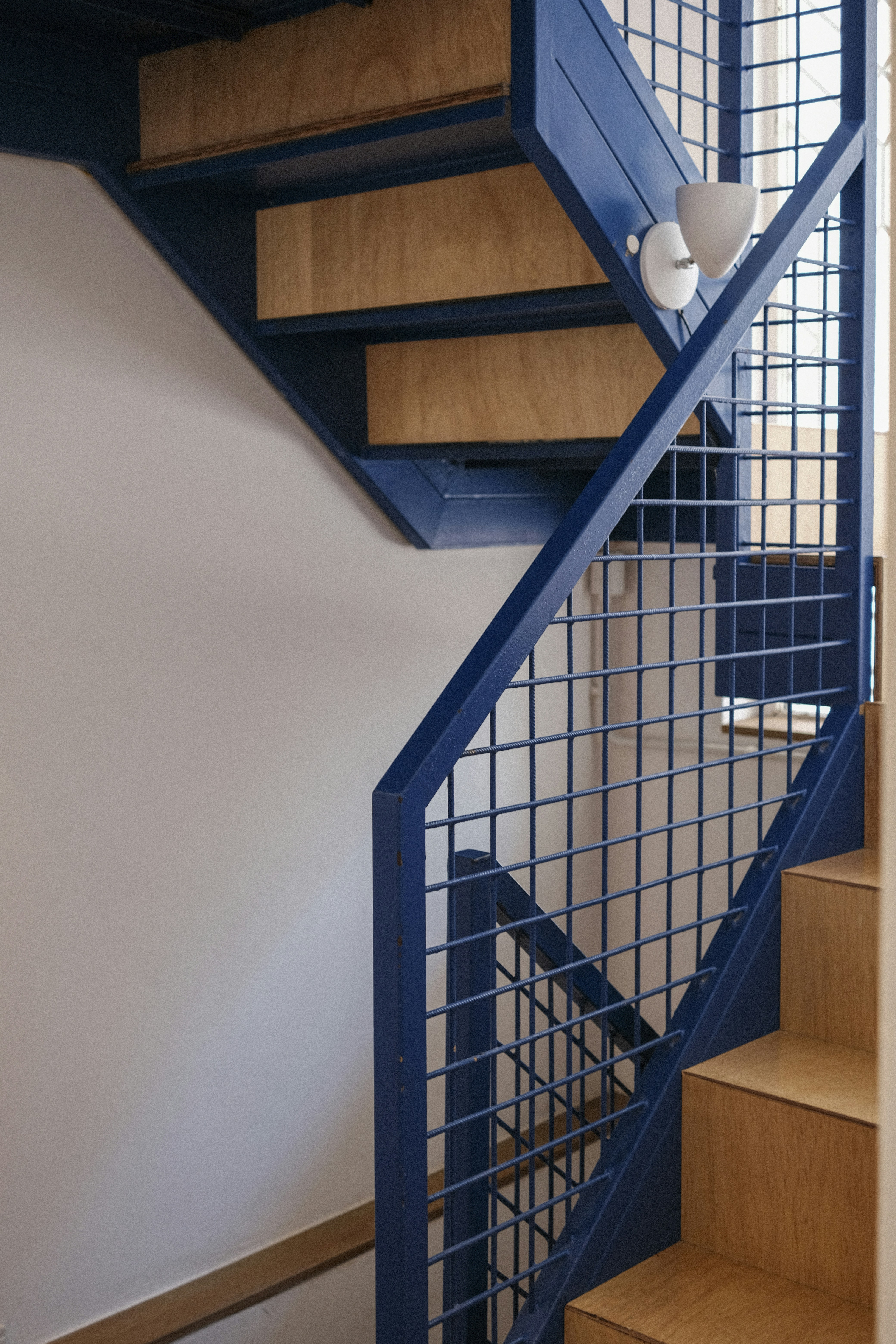 Modern blue staircase with wooden steps and railing. photo – Free ...