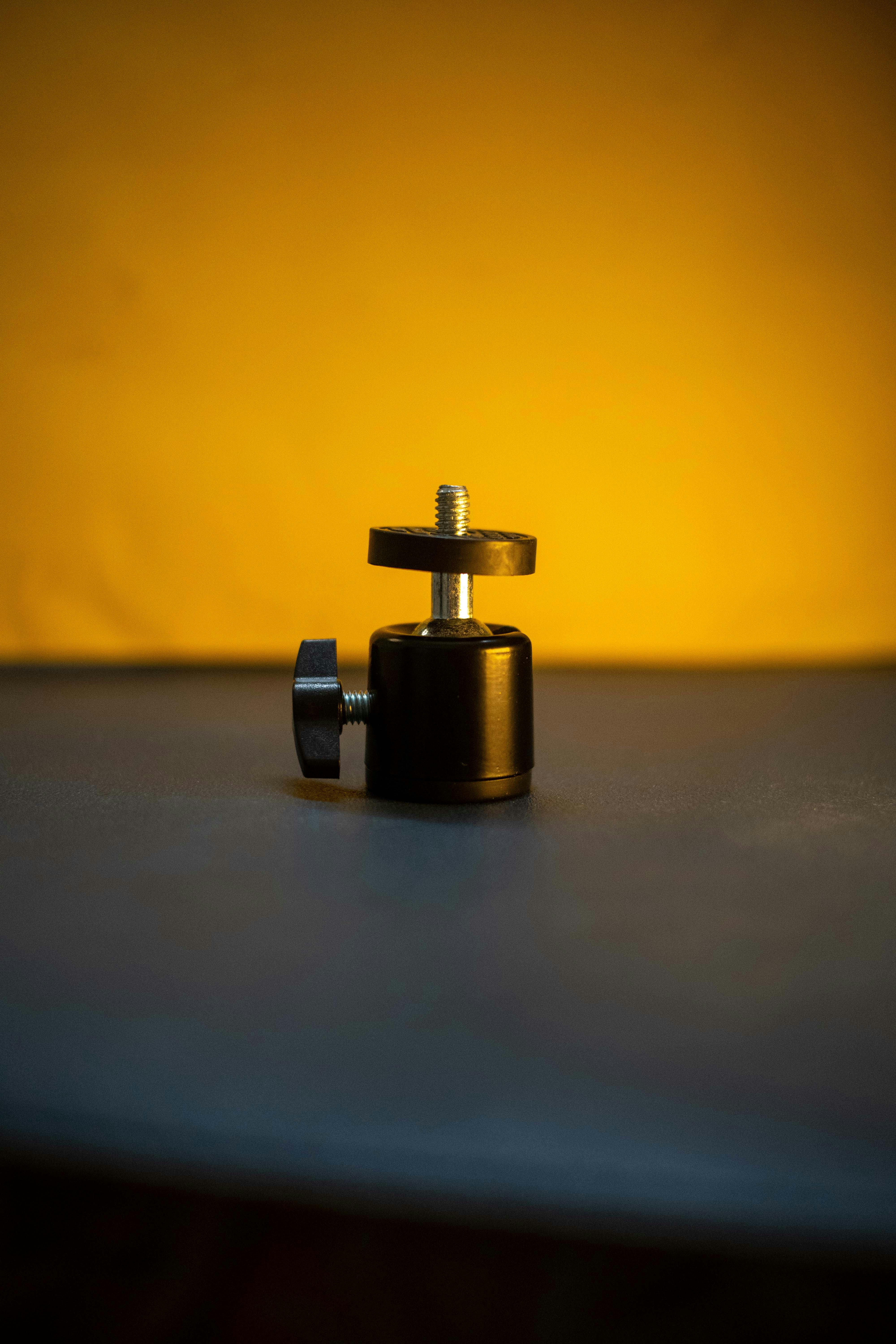Amber Stage, Tiny Clamp: A Close-Up Study in Precision