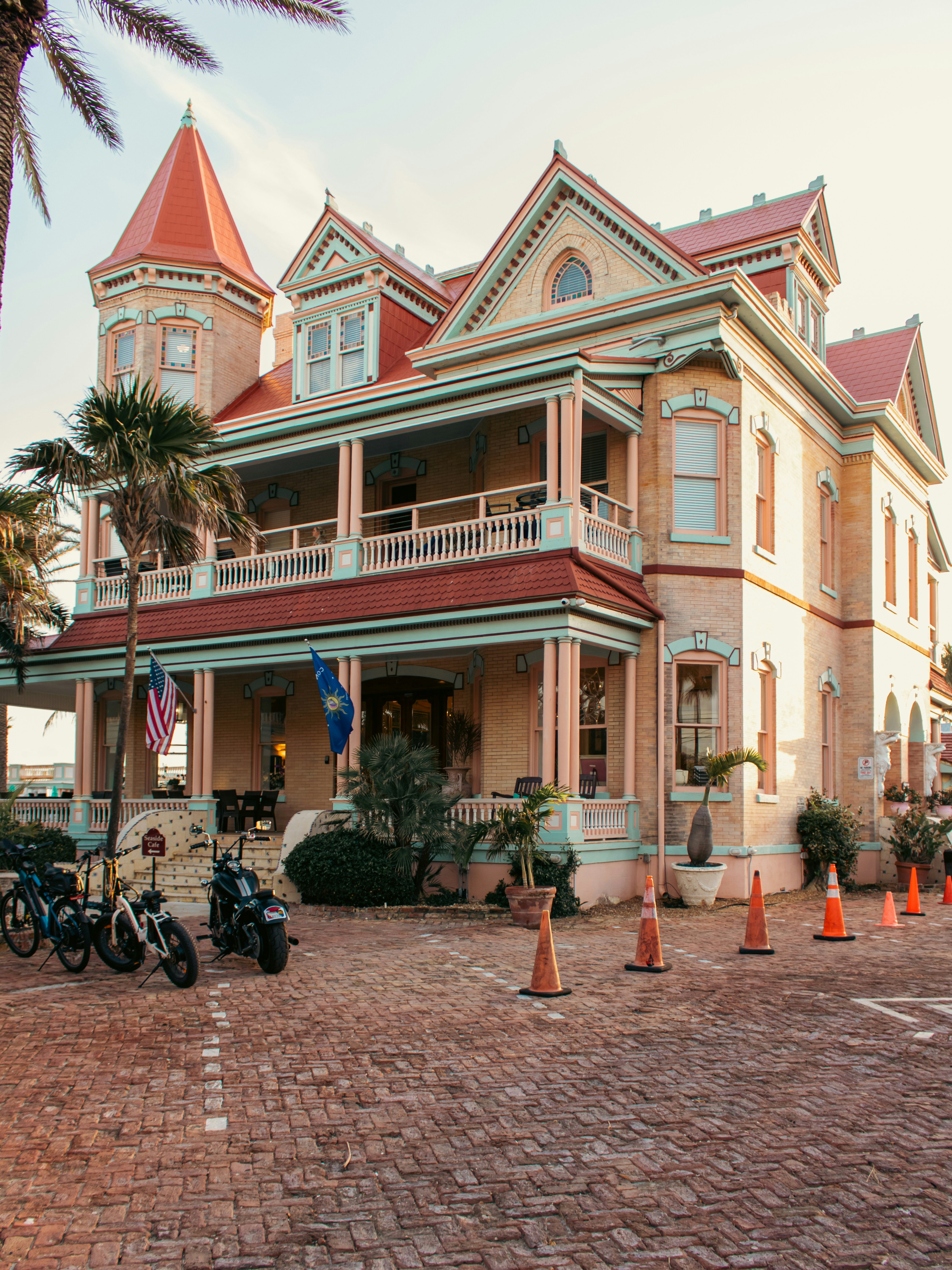 Sunlit Seaside Villa: pastel Victorian on brick plaza