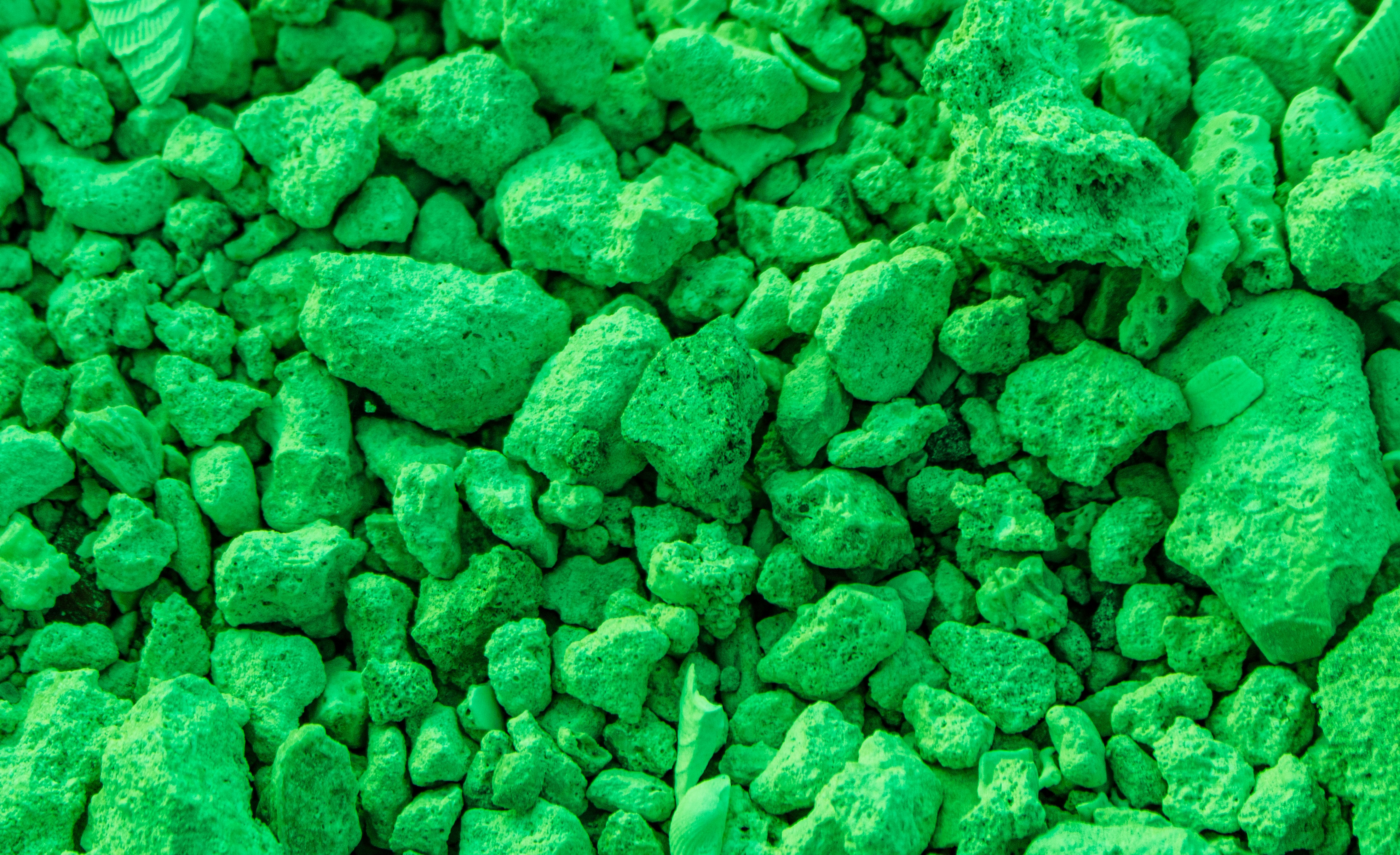 An experimental background photo made by me | Pile of bright green rocks and textured rocks