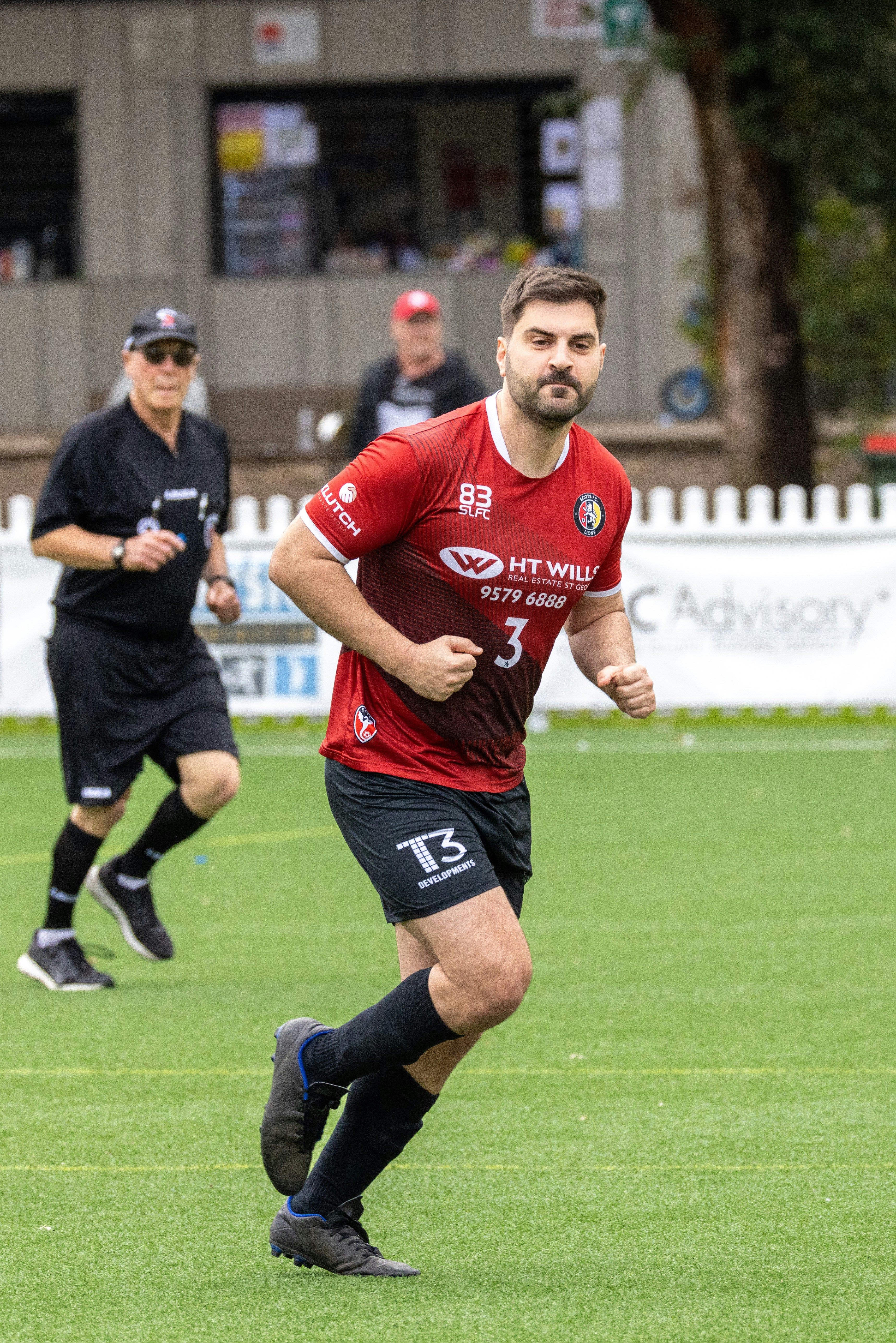 Red on the Run: a lone striker powers down the pitch