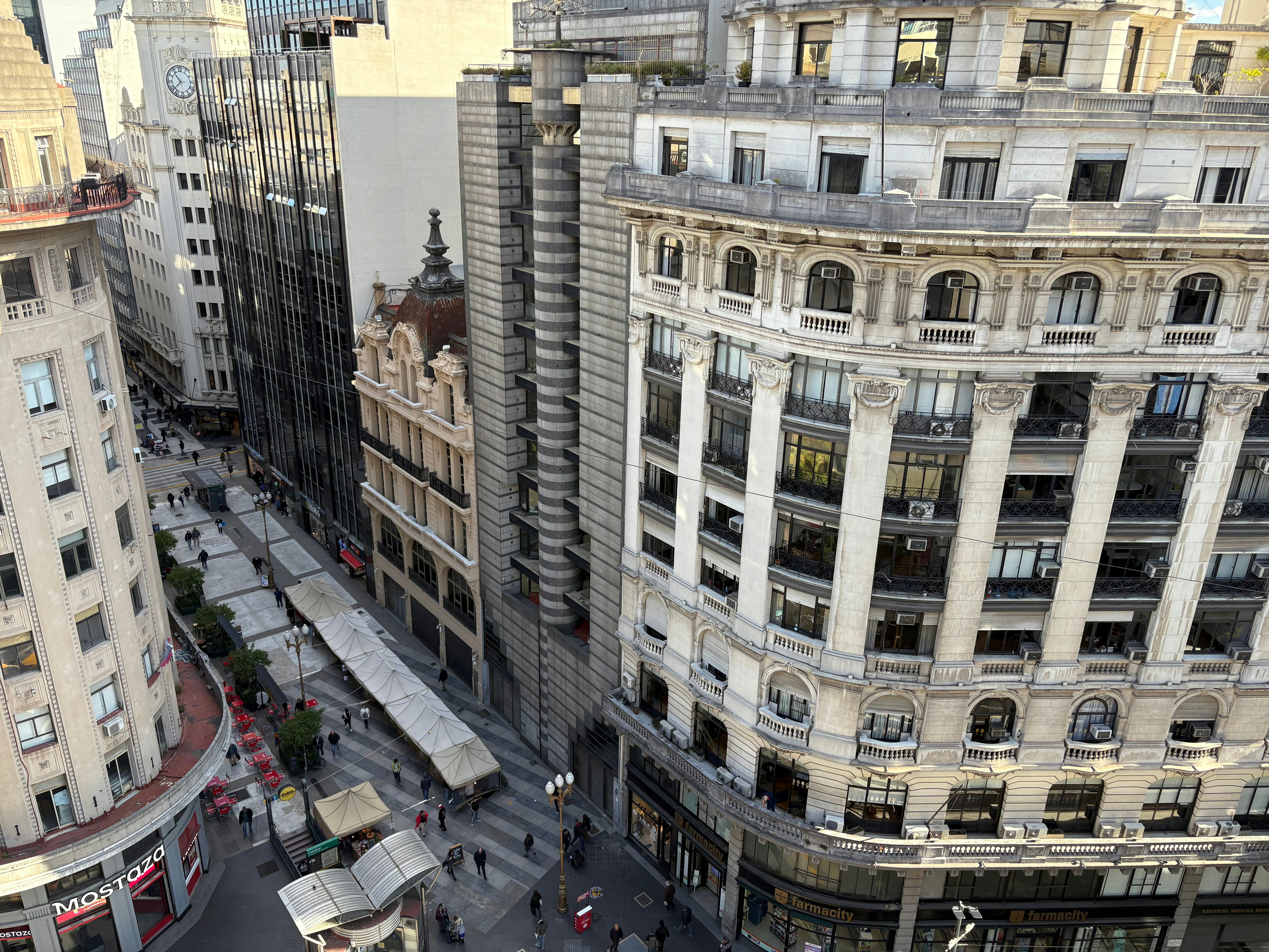 Centro, Buenos Aires, Argentina | Ornate buildings line a bustling city street below.