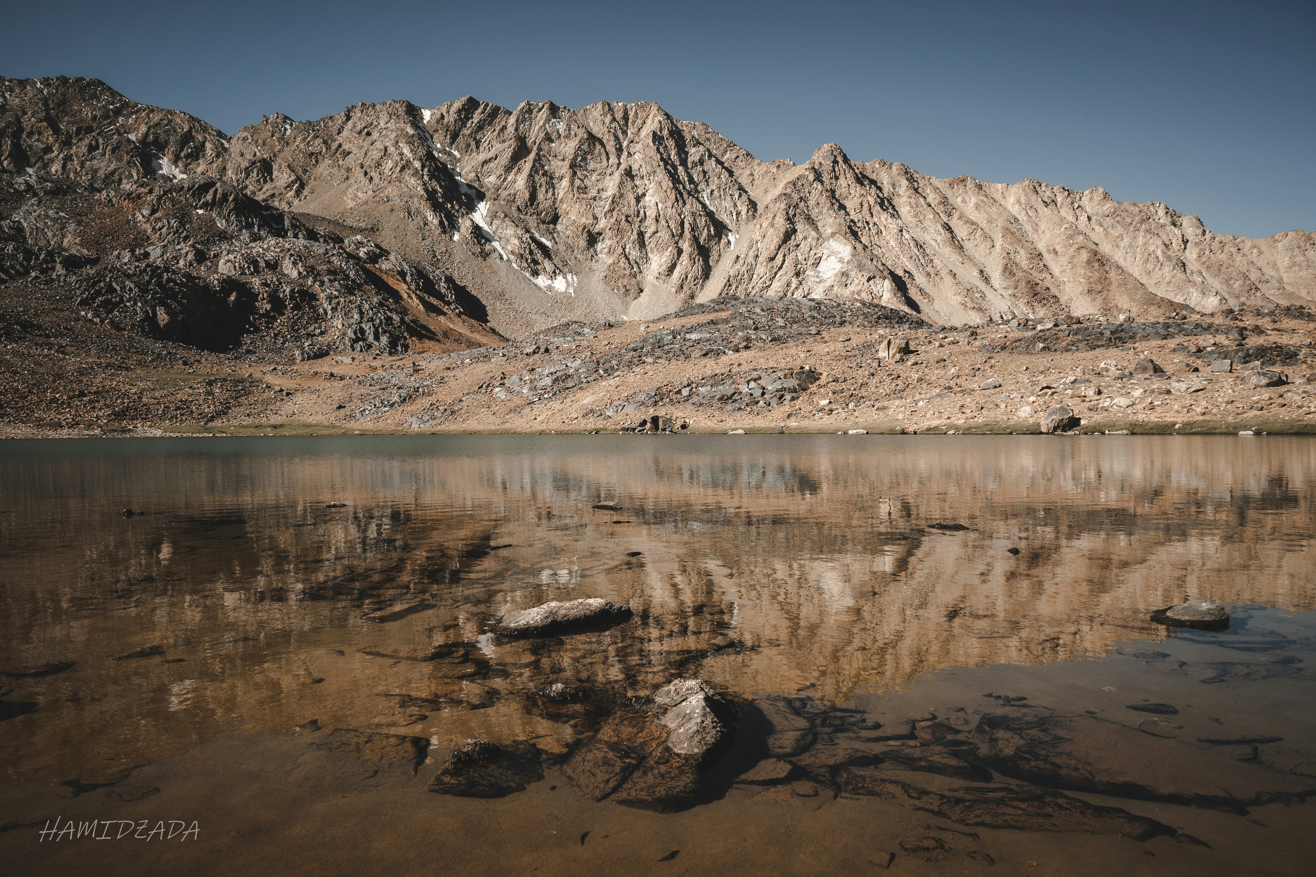 Crag Crown Above a Glassy Tarn