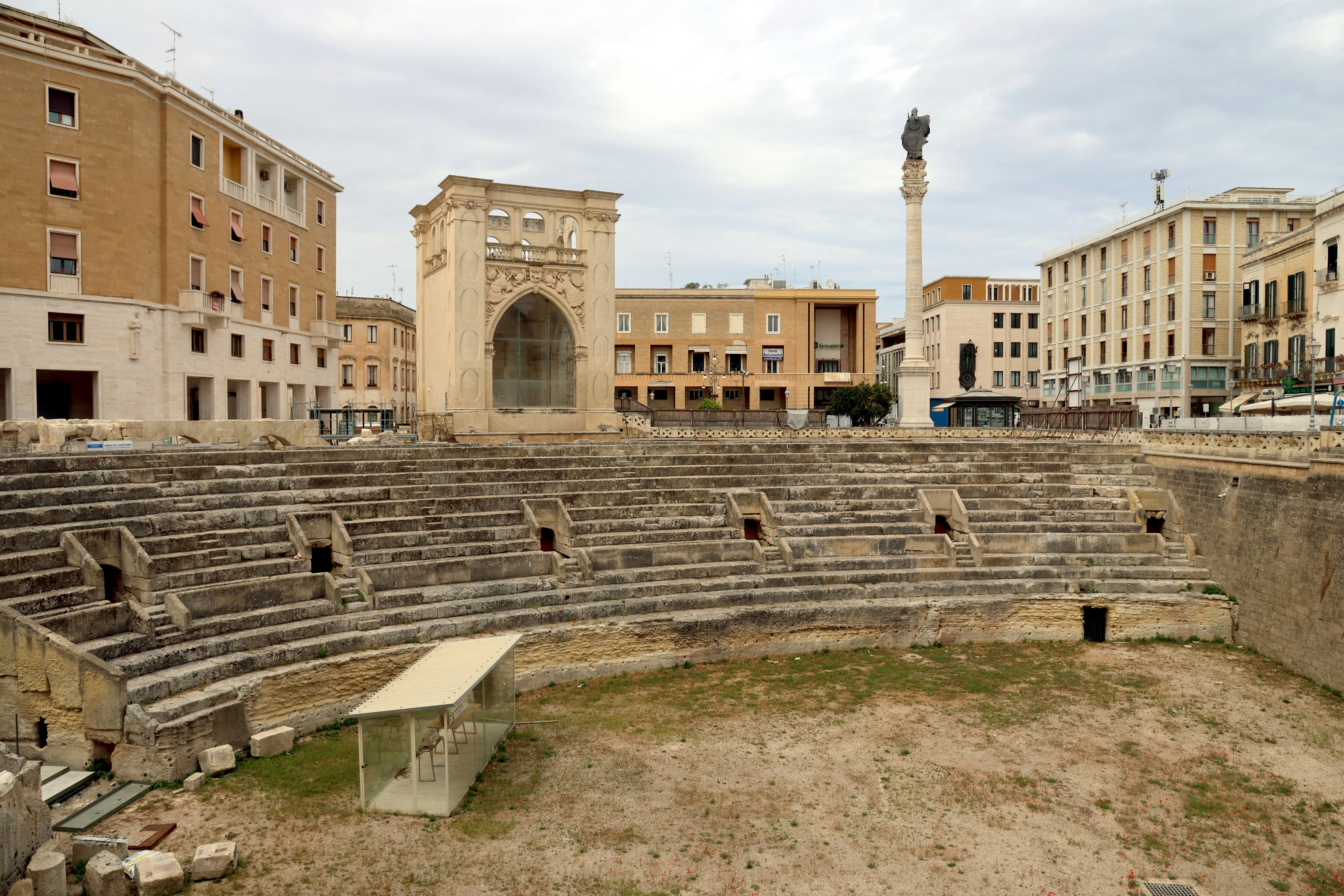 Ancient Amphitheater Undersky: Stone Tiers and Monumental Arch