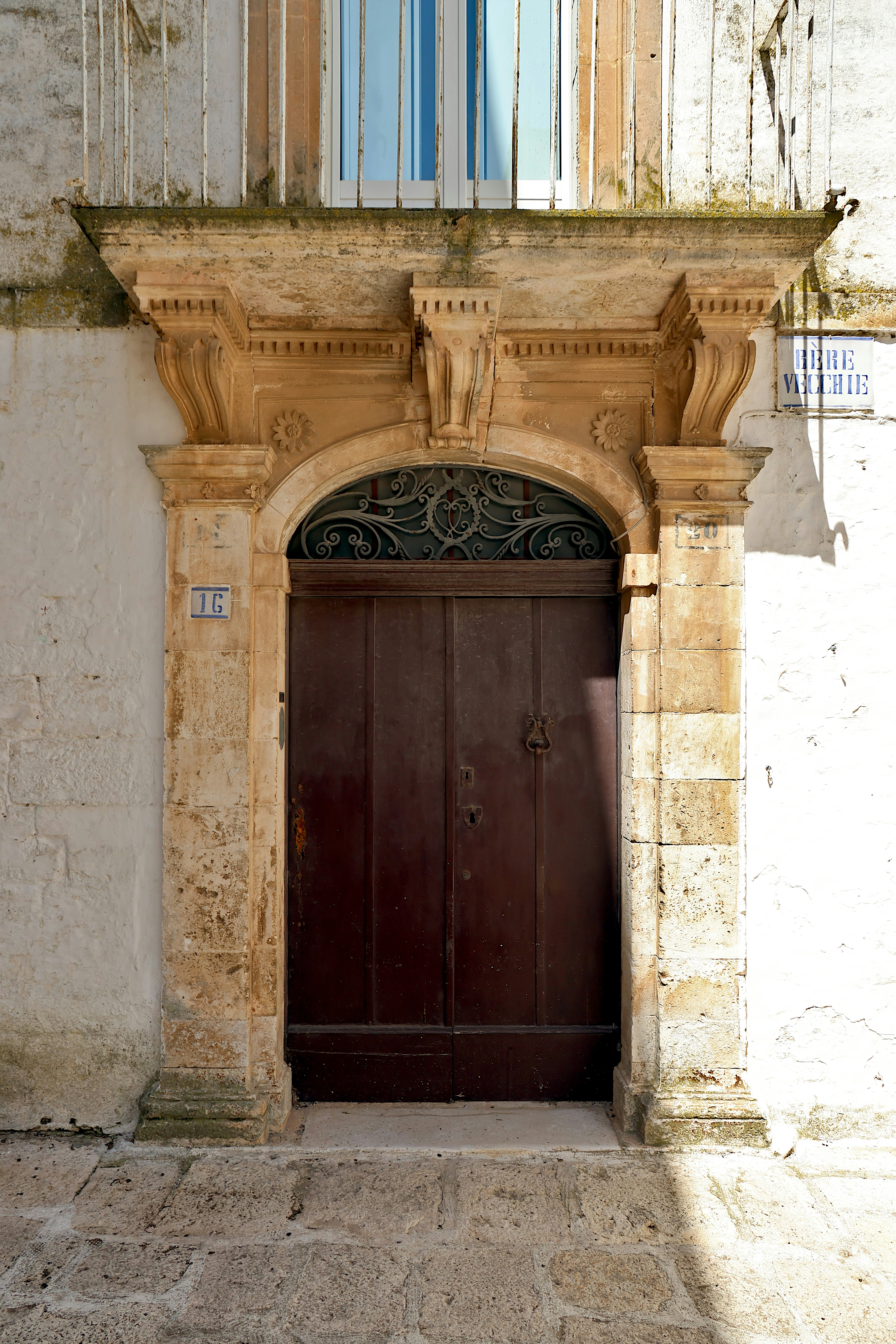 Ornate wooden door set in stone facade