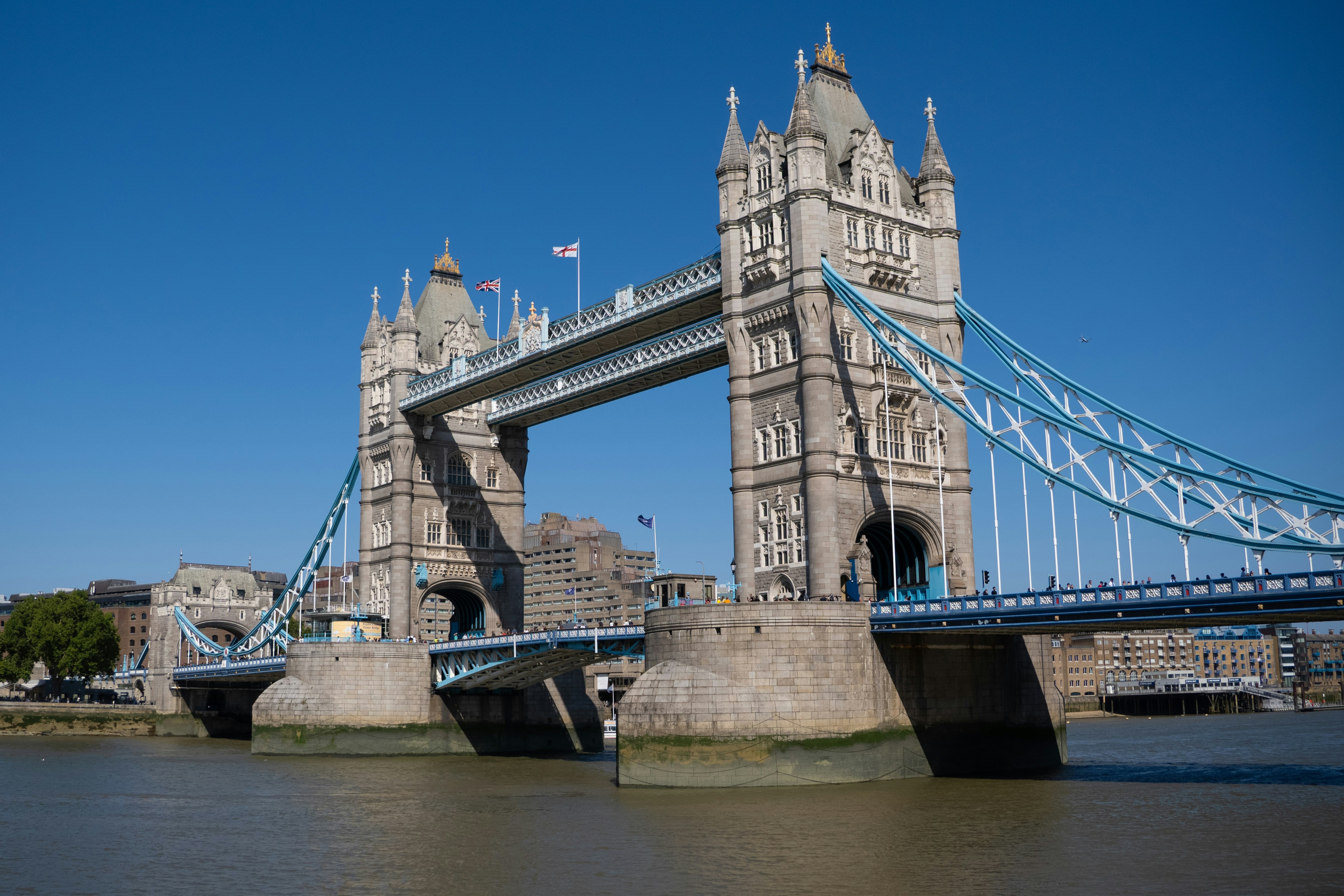 The Tower Bridge stands over the River Thames on a clear day. | Tower bridge over the river thames in london