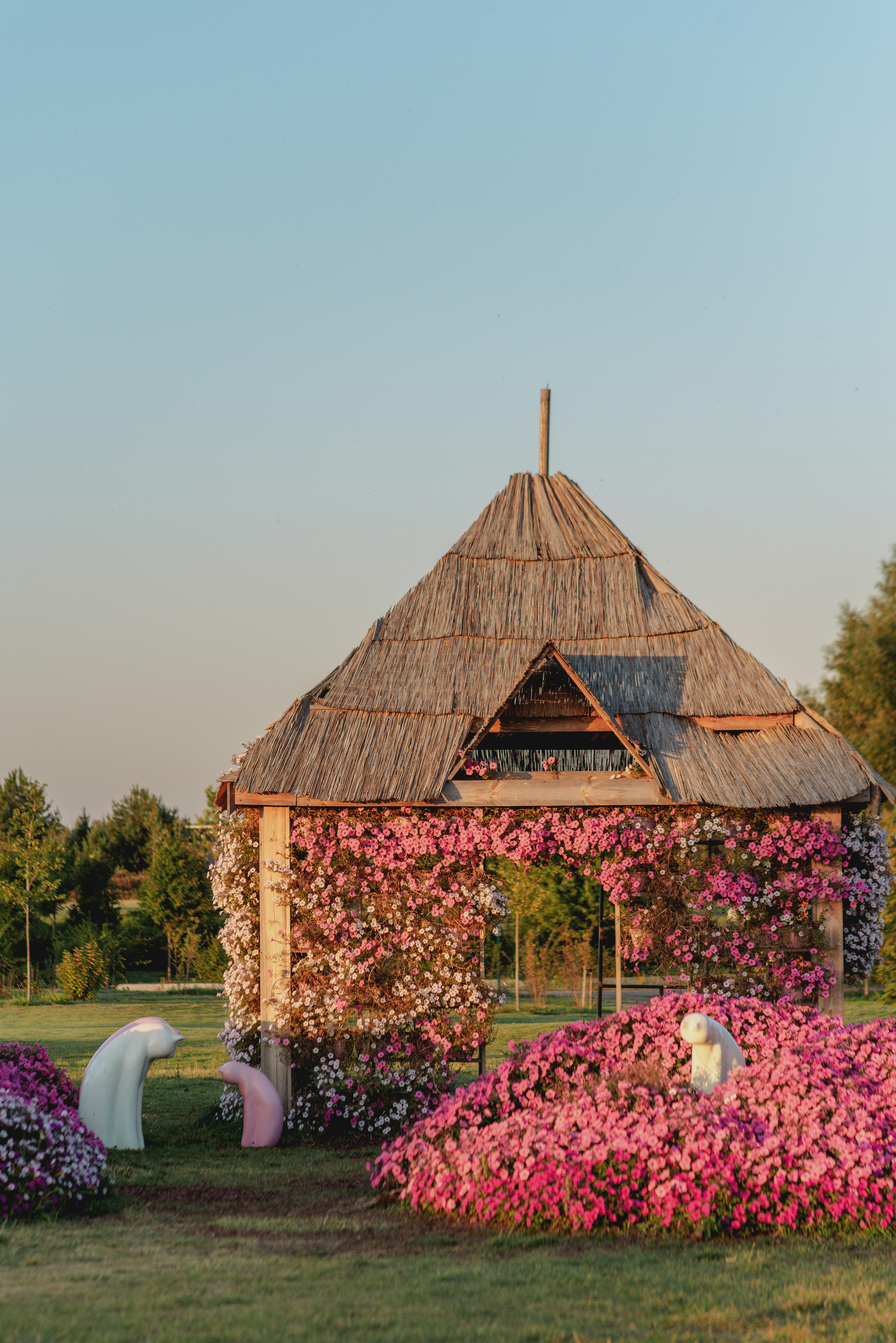Whimsical Floral Retreat Under a Thatched Roof