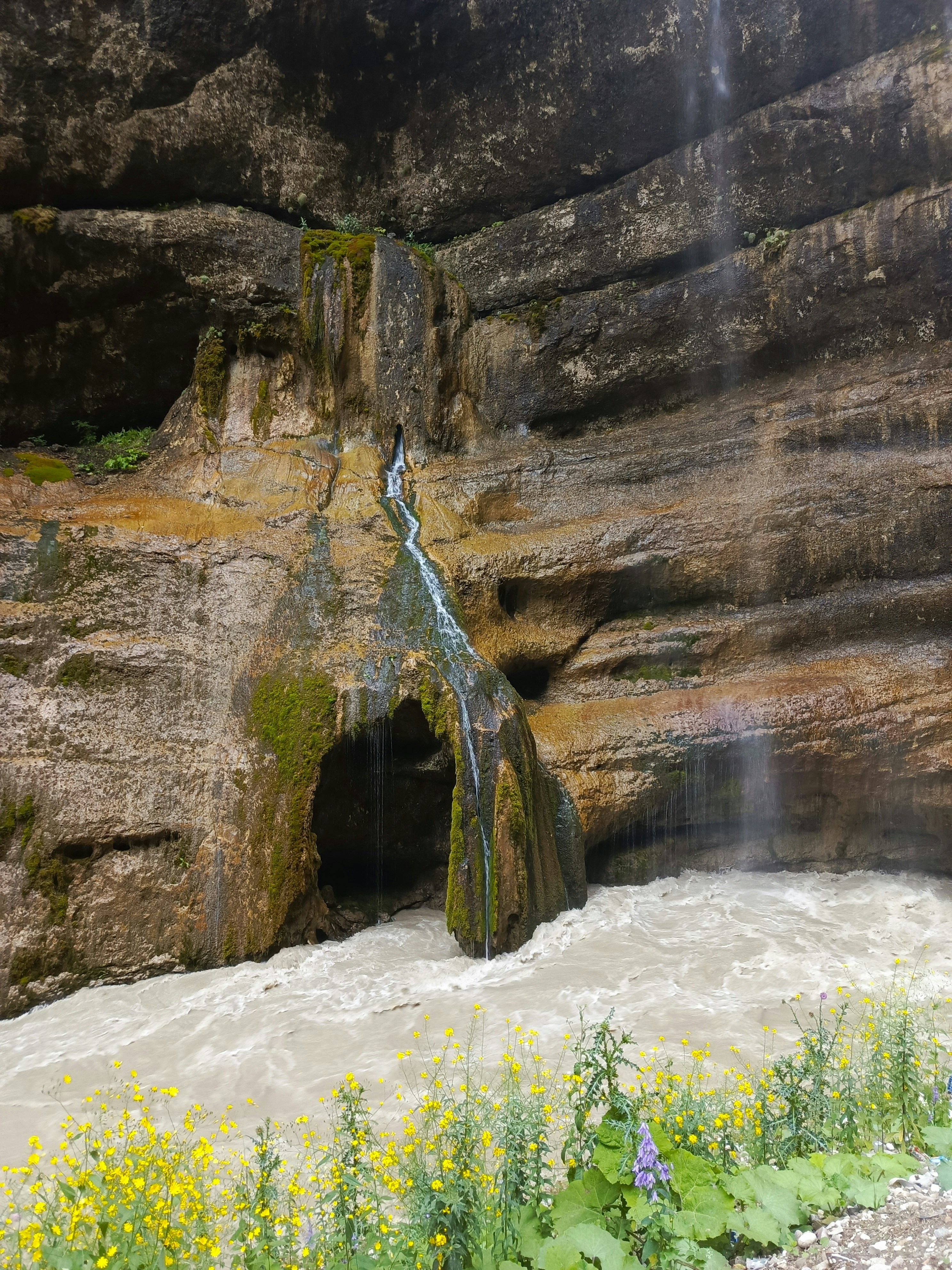 Cascade in a Moss-Trimmed Rock Portal