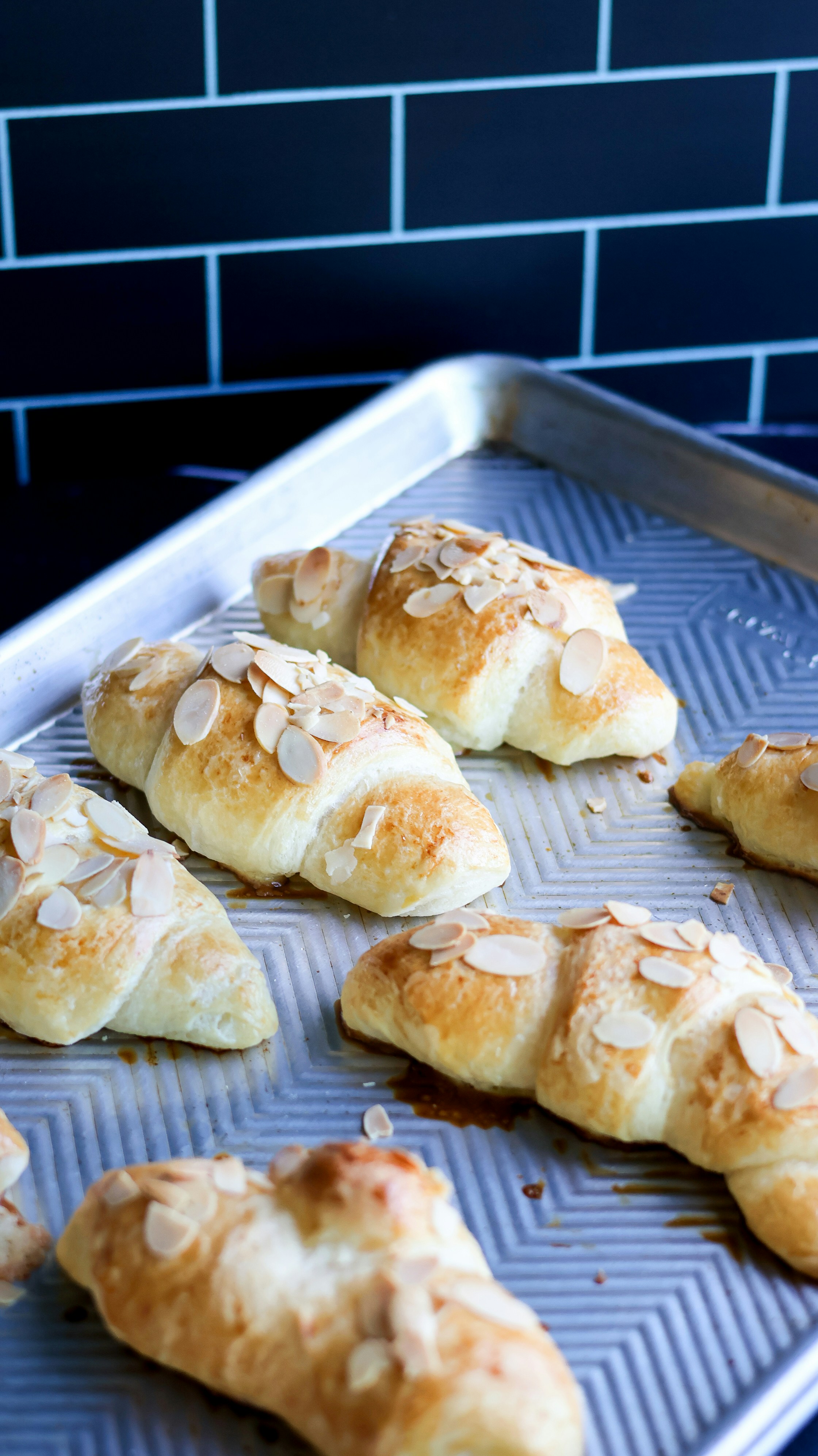 A golden, flaky almond croissant, fresh from the oven.