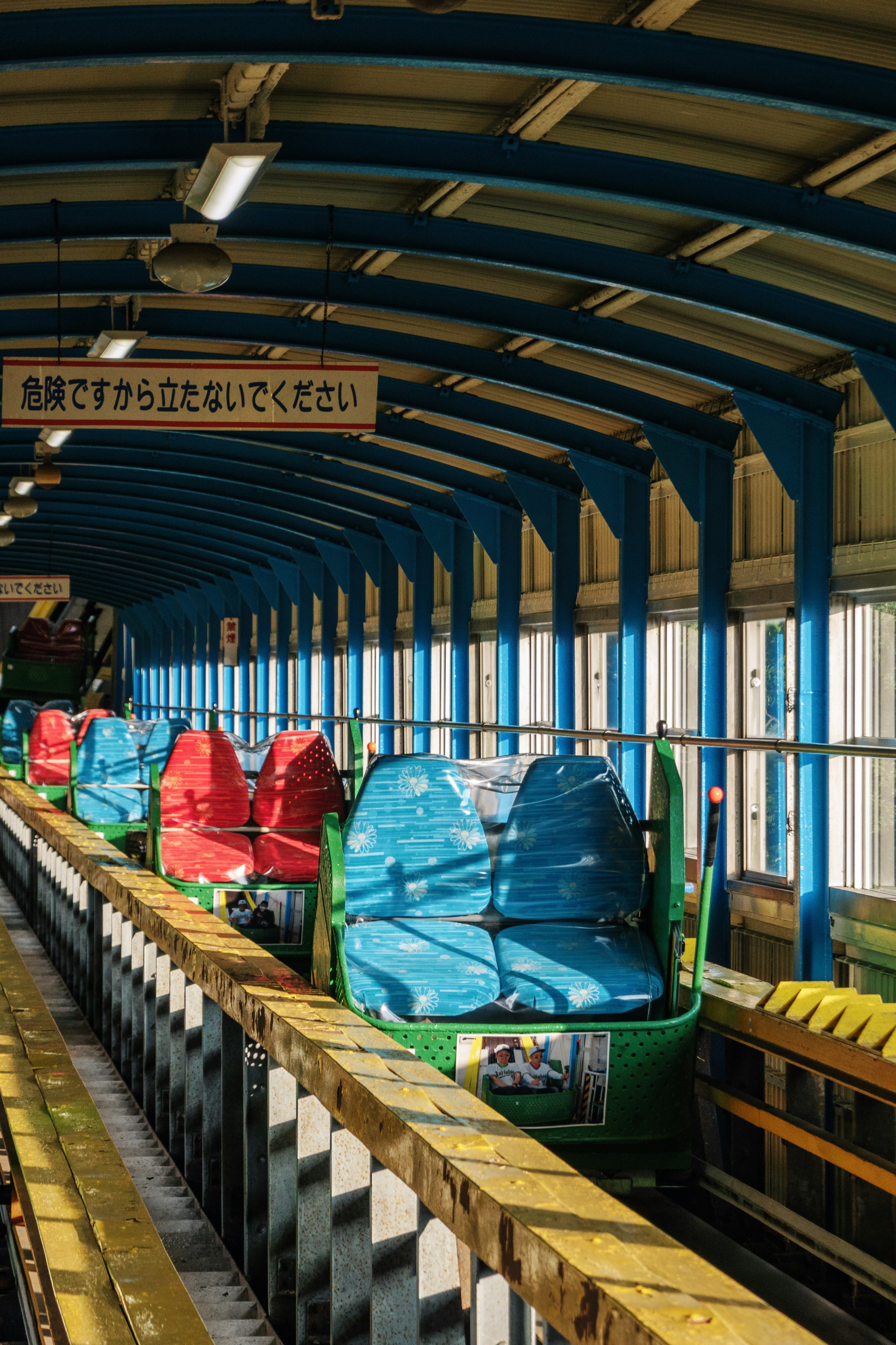 Colorful roller coaster cars on a track