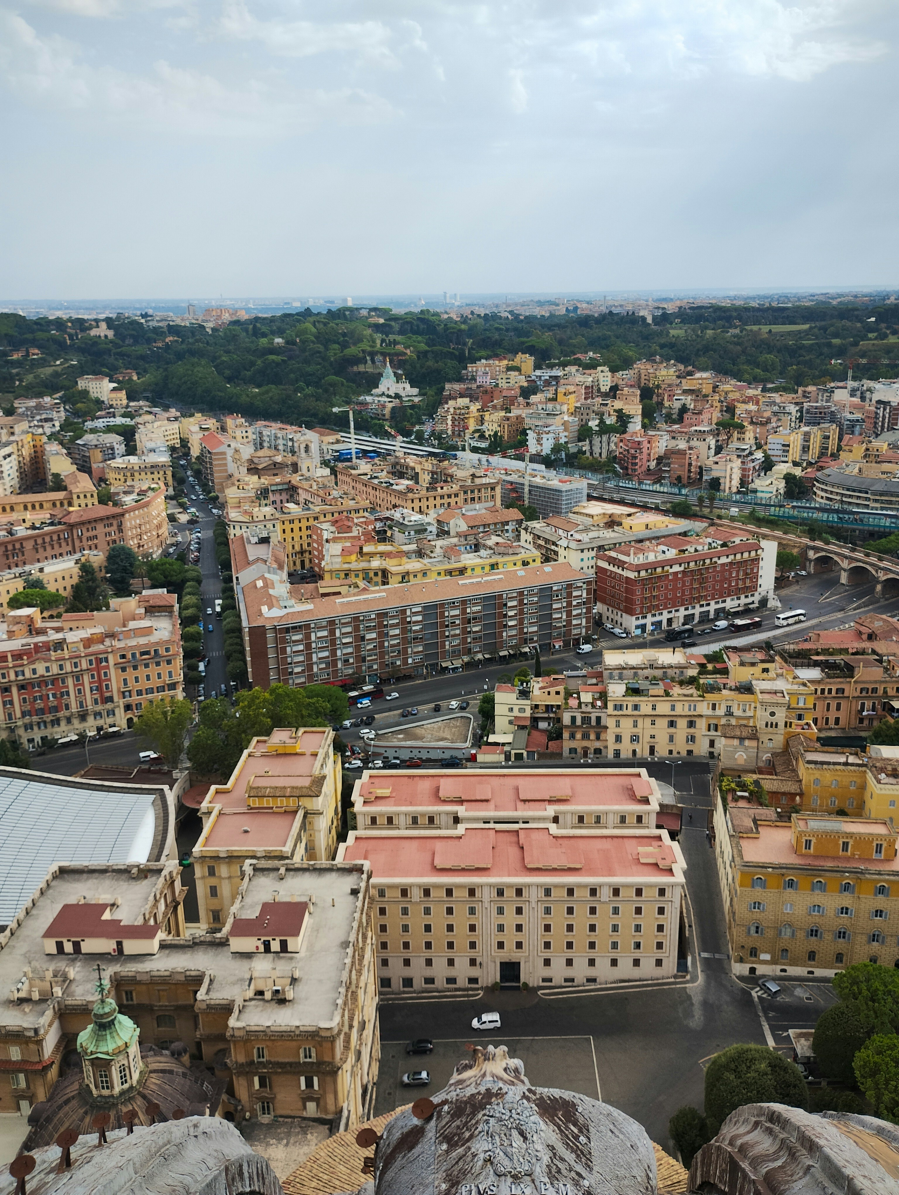A beautiful aerial view of the city of Rome, Italy with several buildings and streets. | Aerial view of a european city with historic buildings.