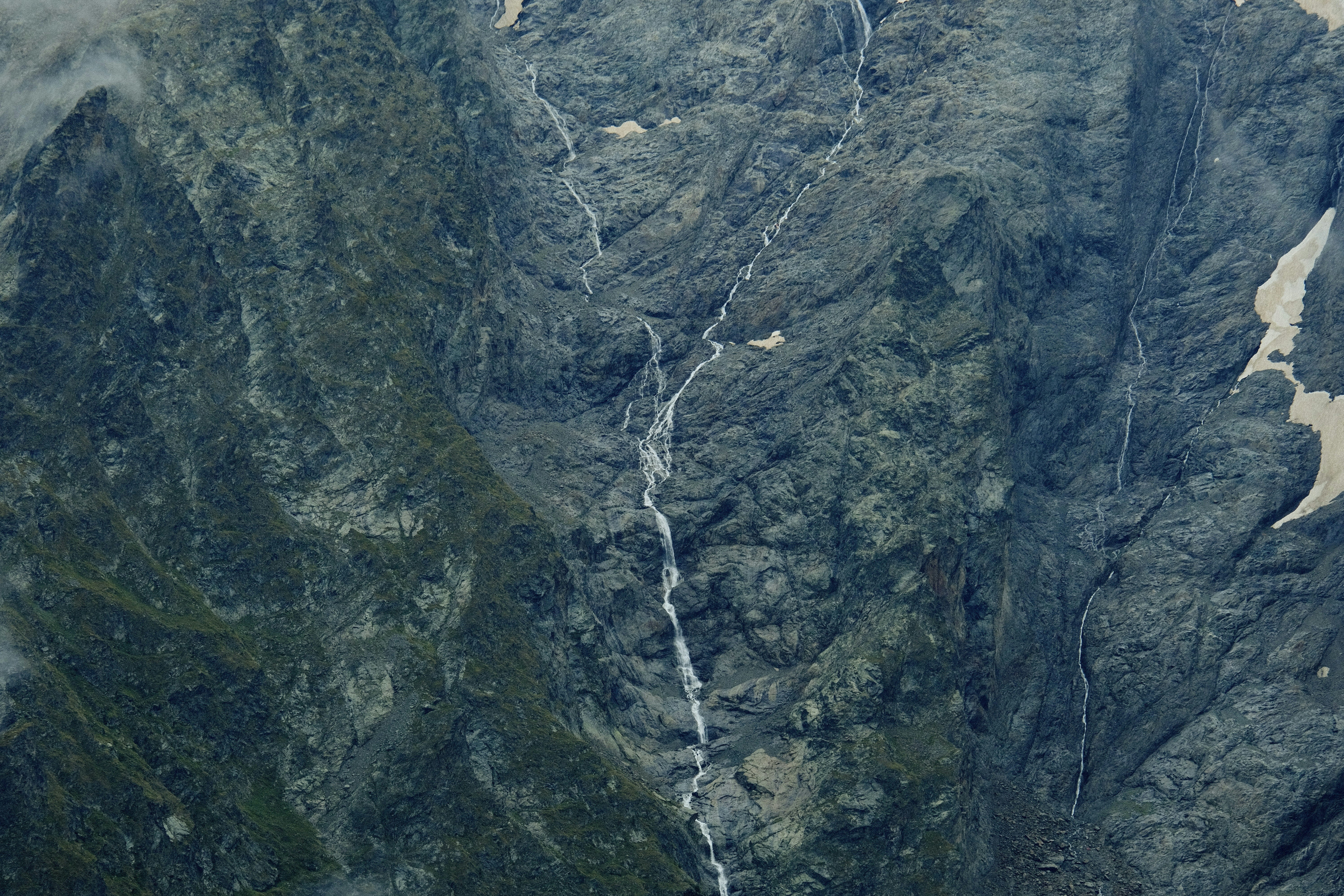 Waterfalls cascade down a rocky mountain slope. photo – Free Image on ...