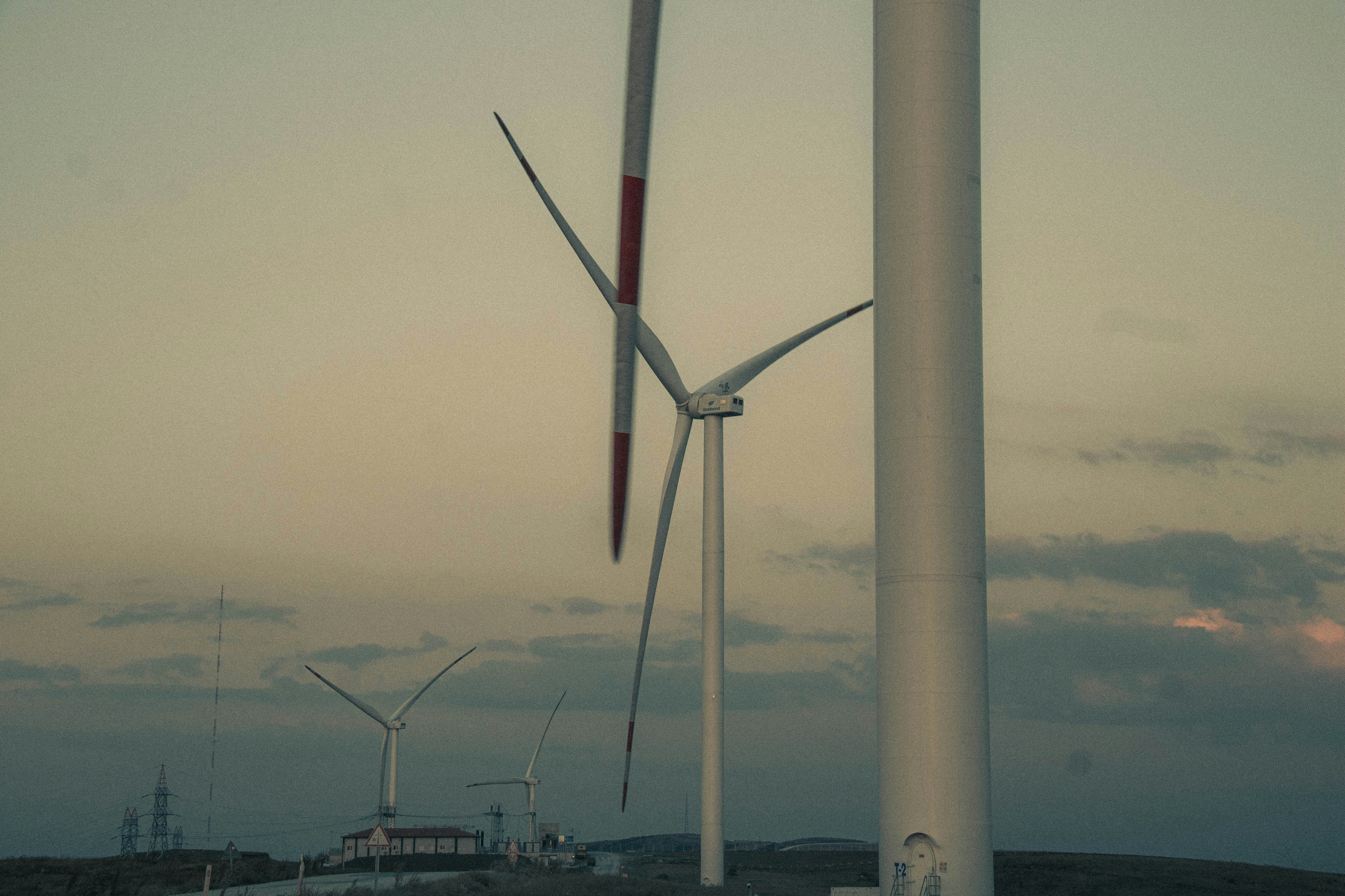 Windmill Diaries | Wind turbines stand tall against a dusky sky.