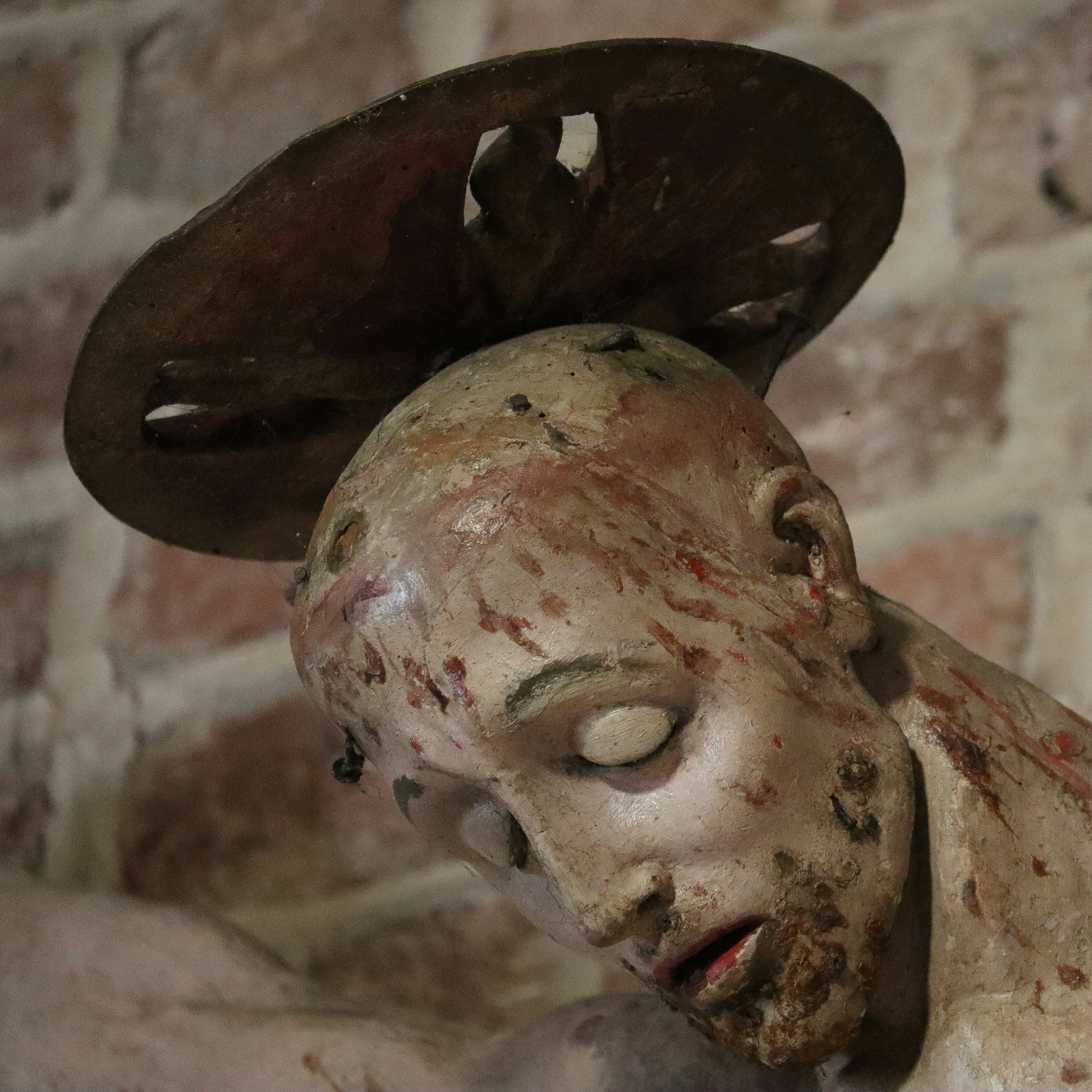 Close-up of a religious statue with a halo