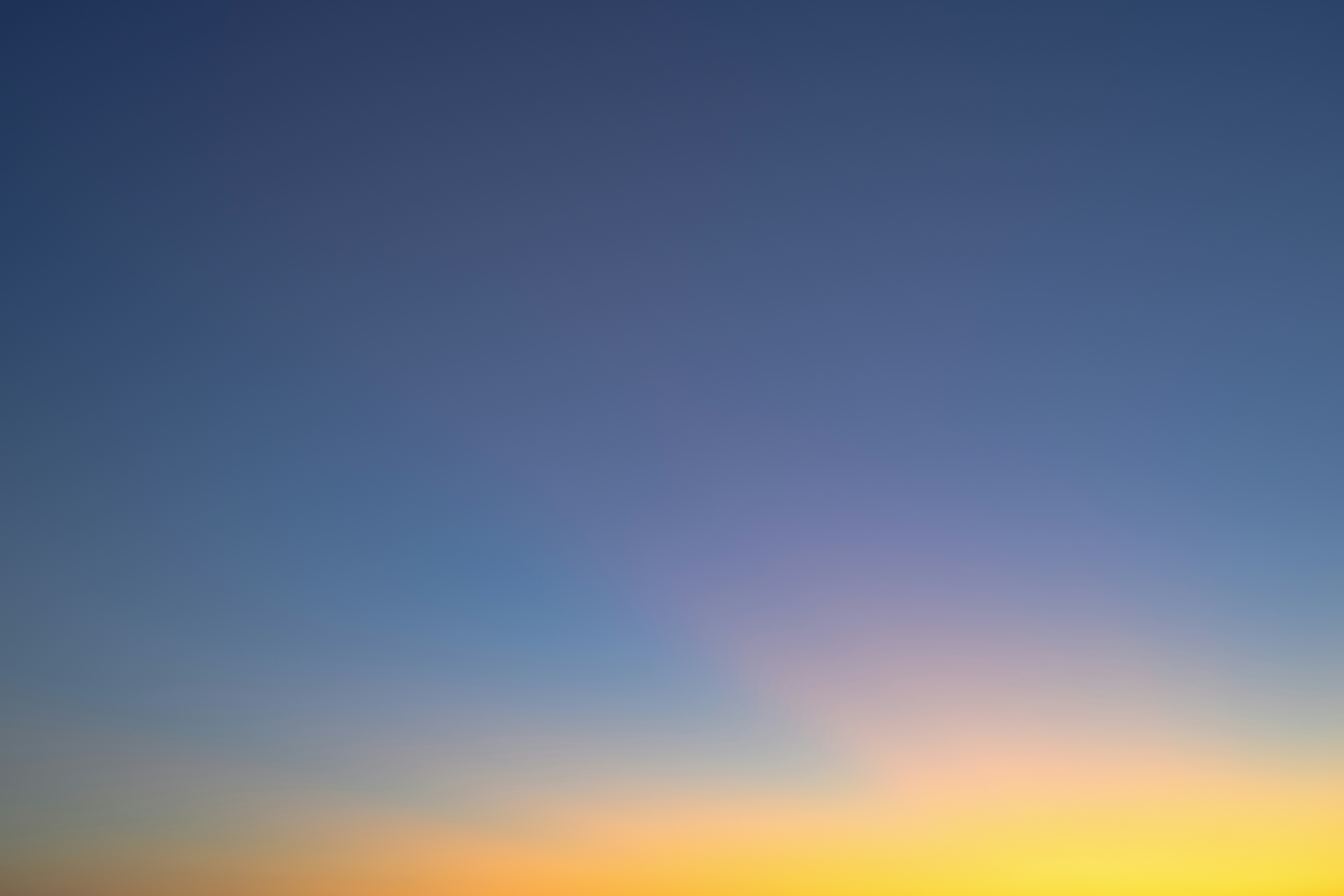 Clear blue sky with subtle sunset colors
