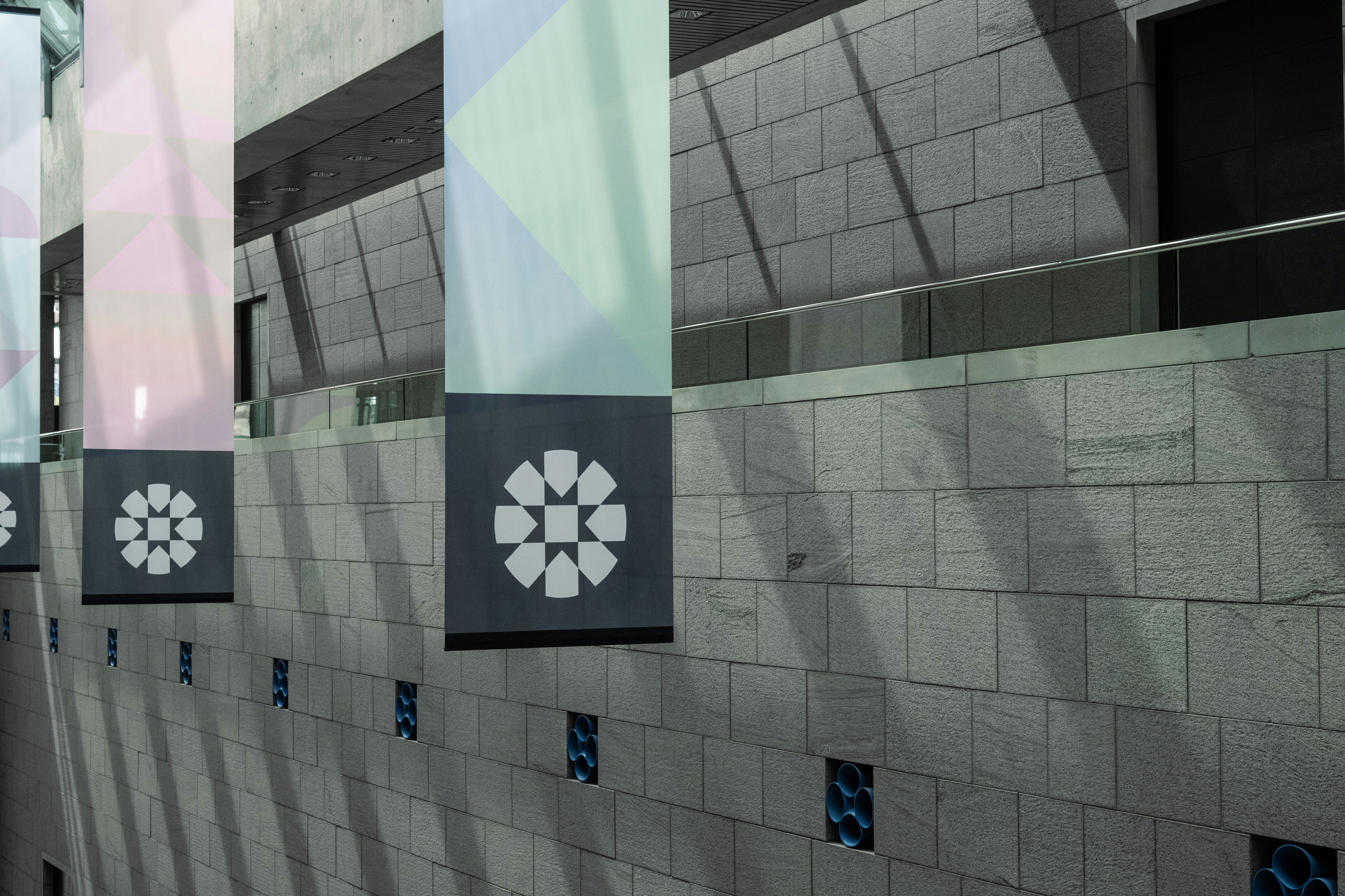Quiet Geometry: Bannered Wall of a Minimalist Atrium