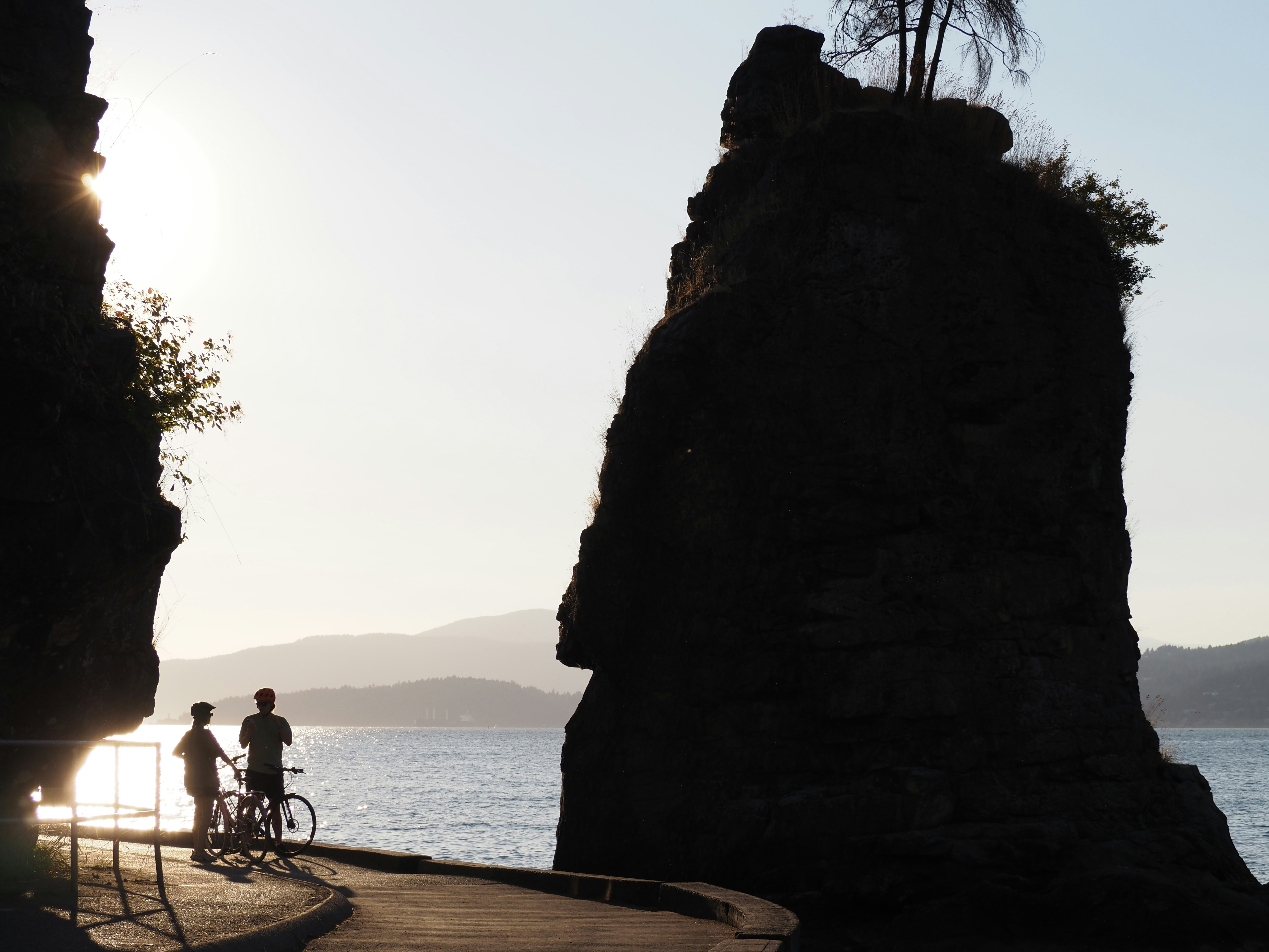 Silhouettes at Dusk: A Journey by the Water