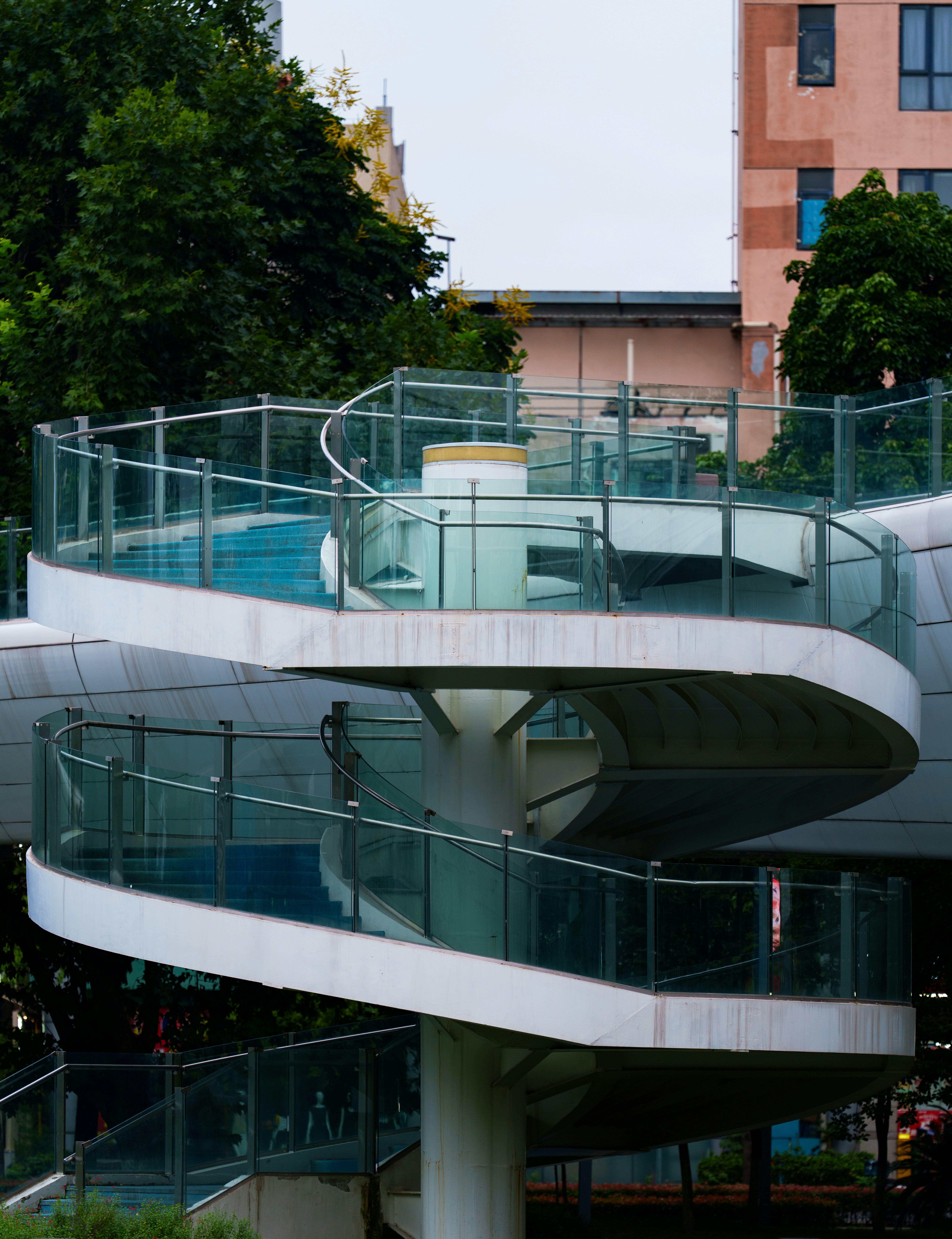 Modern spiral walkway with glass railings
