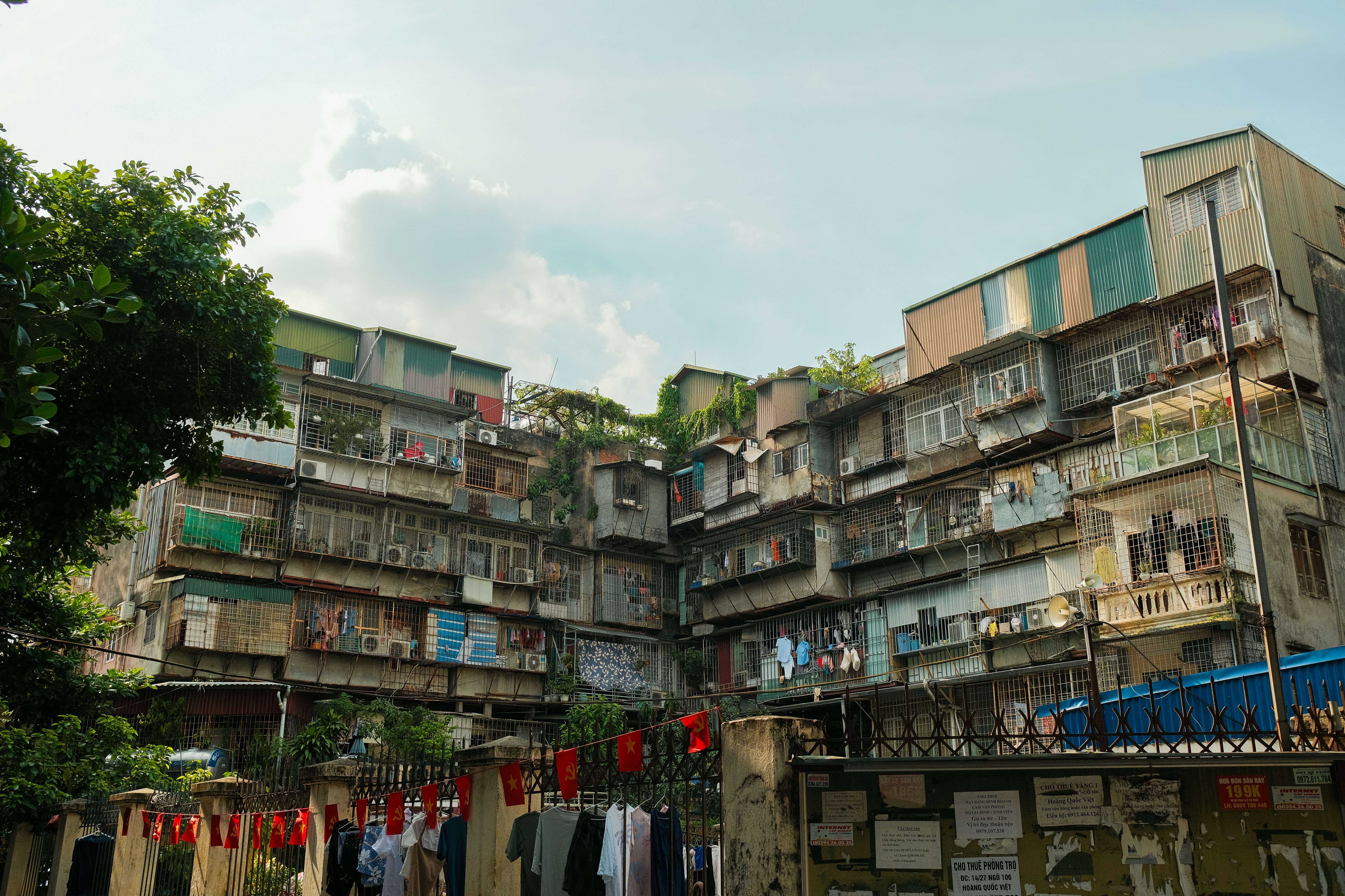 Dense apartment buildings with laundry hanging outside.