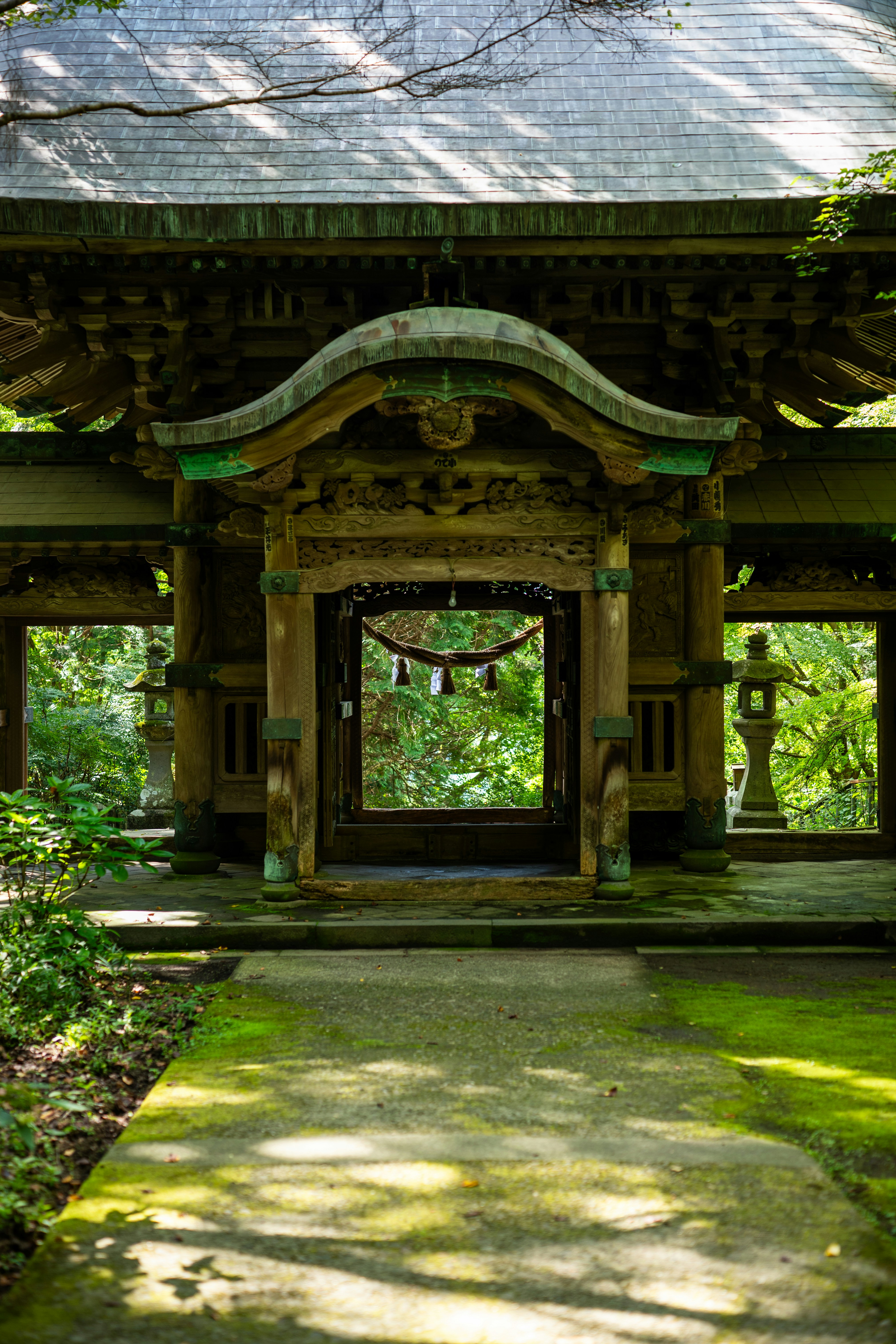 Ancient japanese shrine entrance surrounded by lush greenery photo ...
